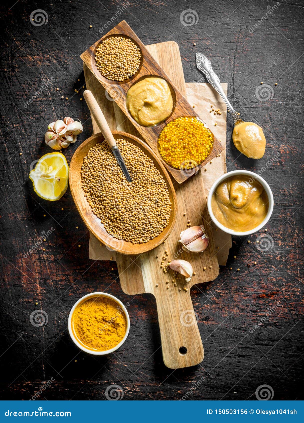 Assortment of Different Types of Mustard with Lemon on a Cutting Board ...