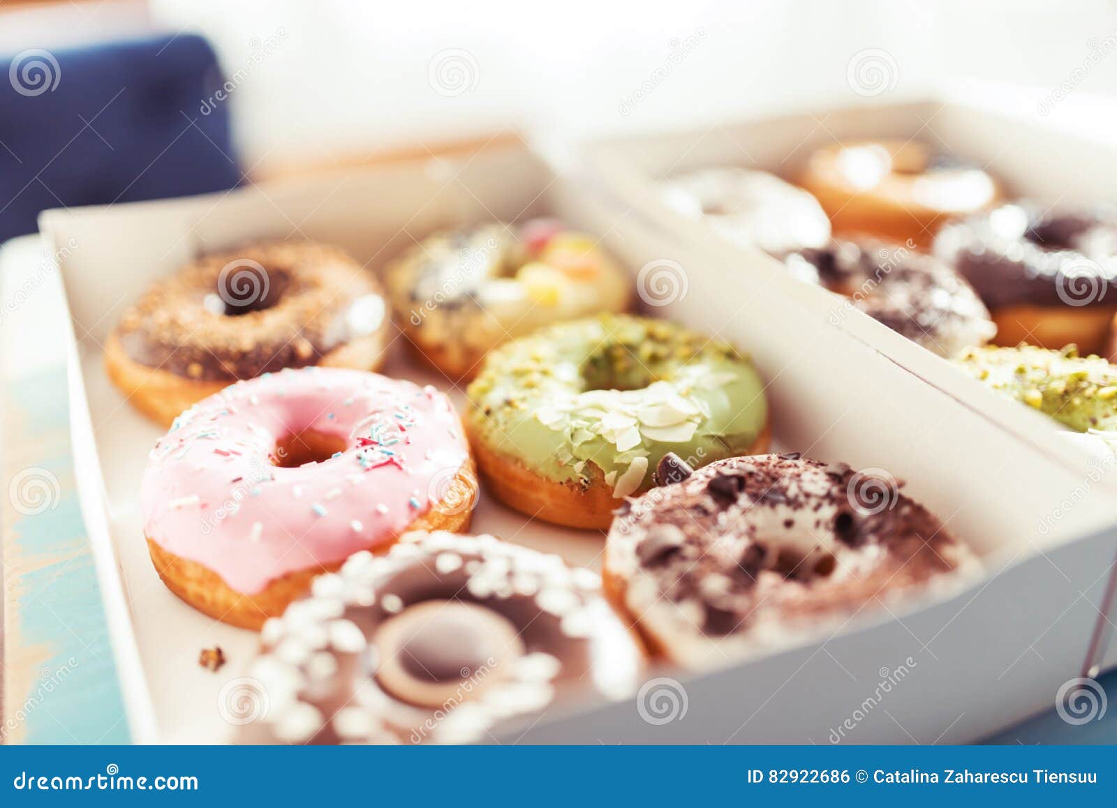 Assortment of Donuts in a Delivery Box Stock Photo - Image of almonds ...