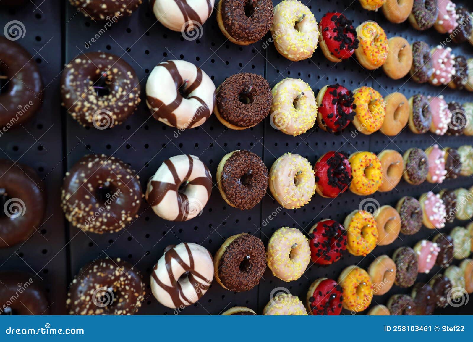 Assortment of Donuts with Various Colors and Toppings Stock Image ...