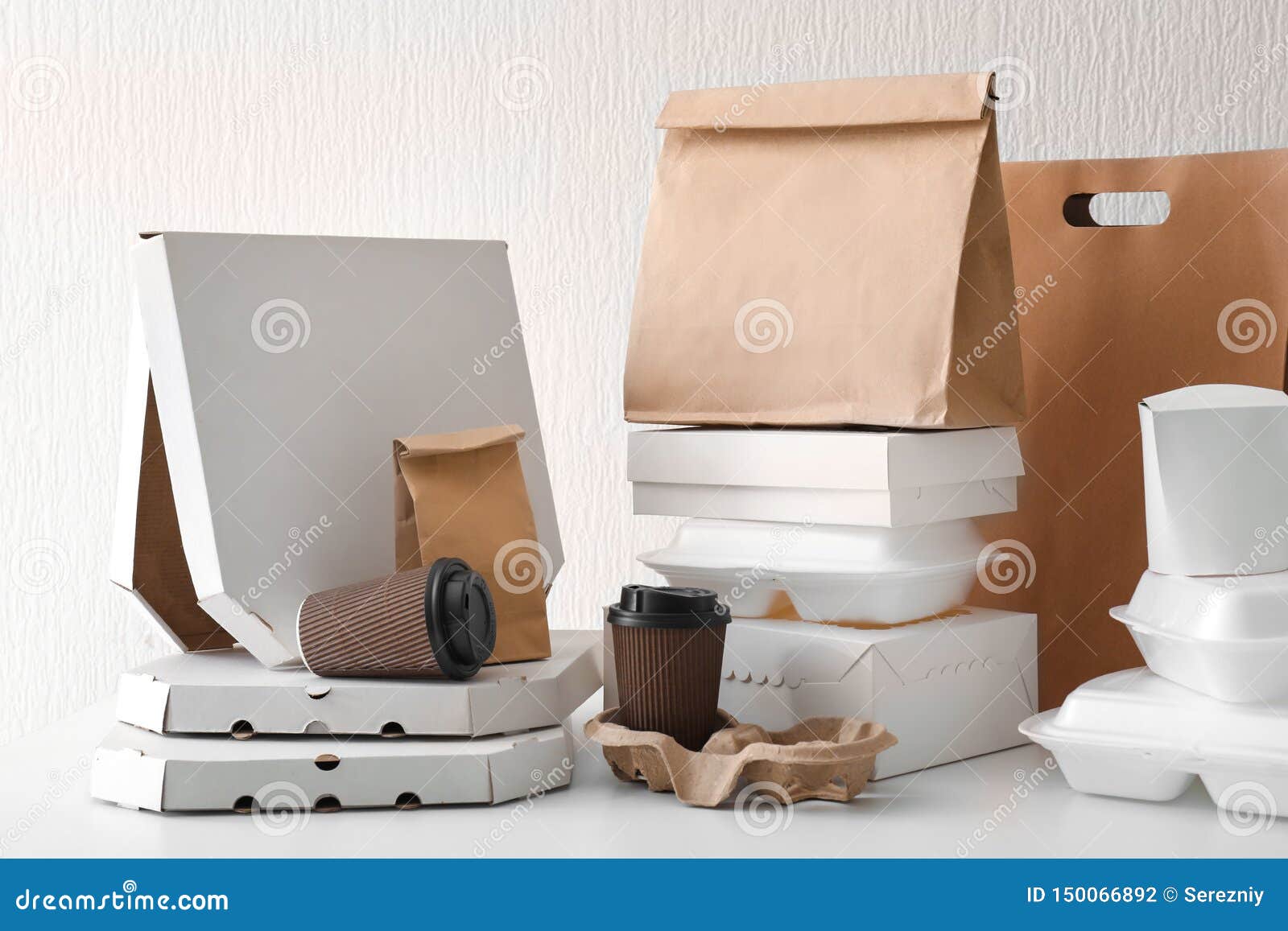 Assortment of Food Delivery Containers on White Table Stock Photo ...