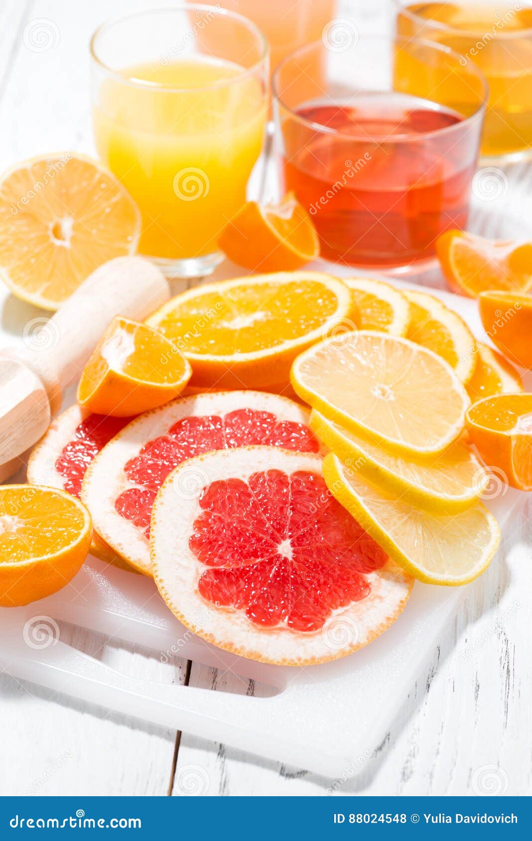 Assortment of Fresh Citrus on a White Board, Vertical Stock Photo ...