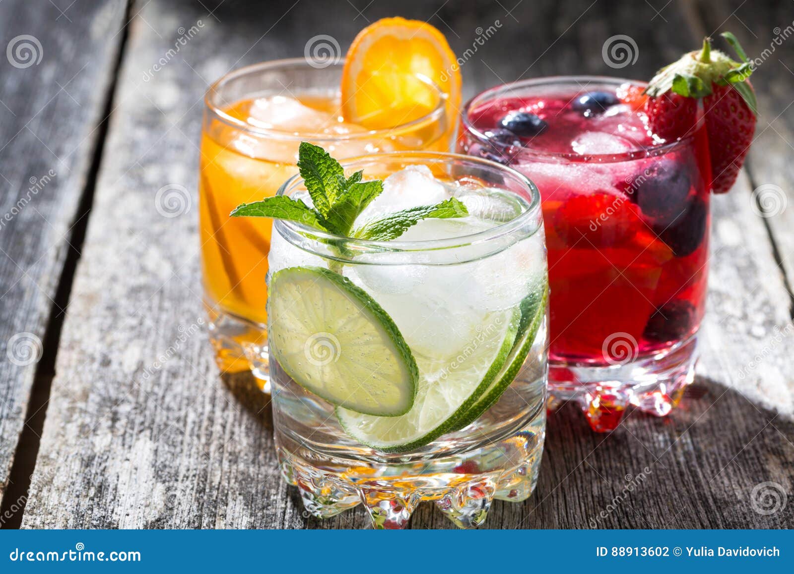 Assortment of Fresh Iced Fruit Drinks on Wooden Background Stock Photo ...