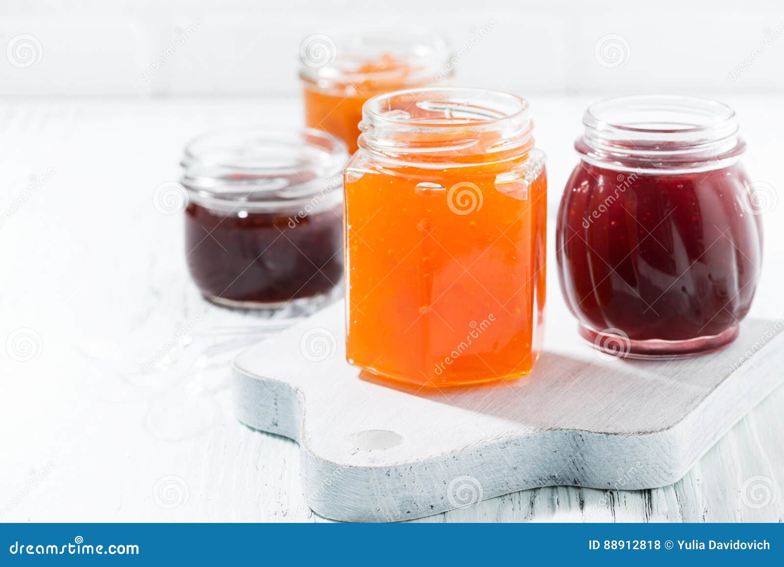 Assortment of Fruit Jams on White Board Stock Photo - Image of ...
