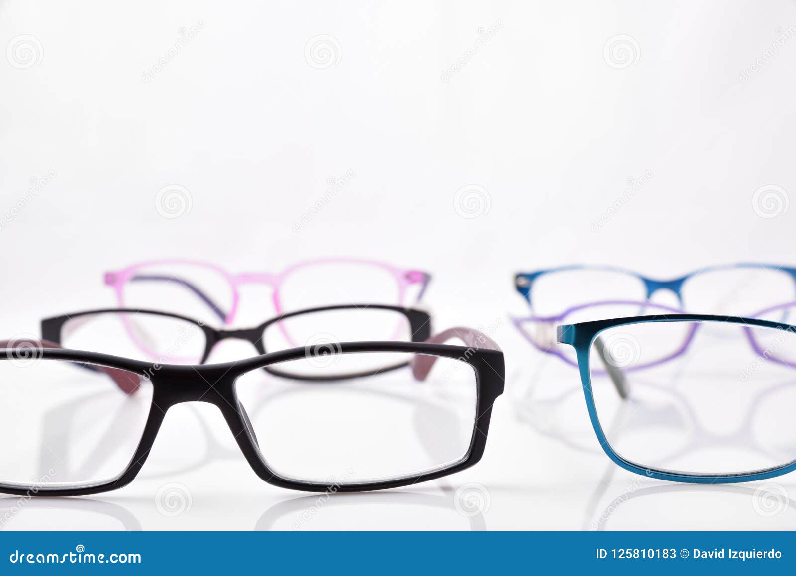 Assortment of Glasses on Table in an Eyewear Store Front Stock Image ...