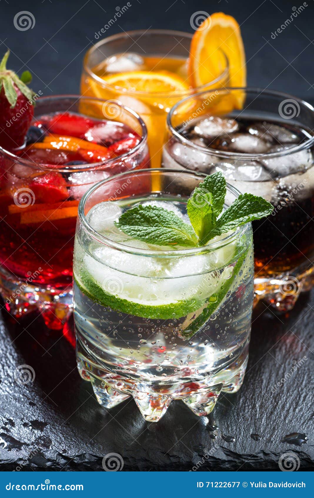 Assortment of Iced Fruit Drinks on a Dark Background, Vertical Stock ...