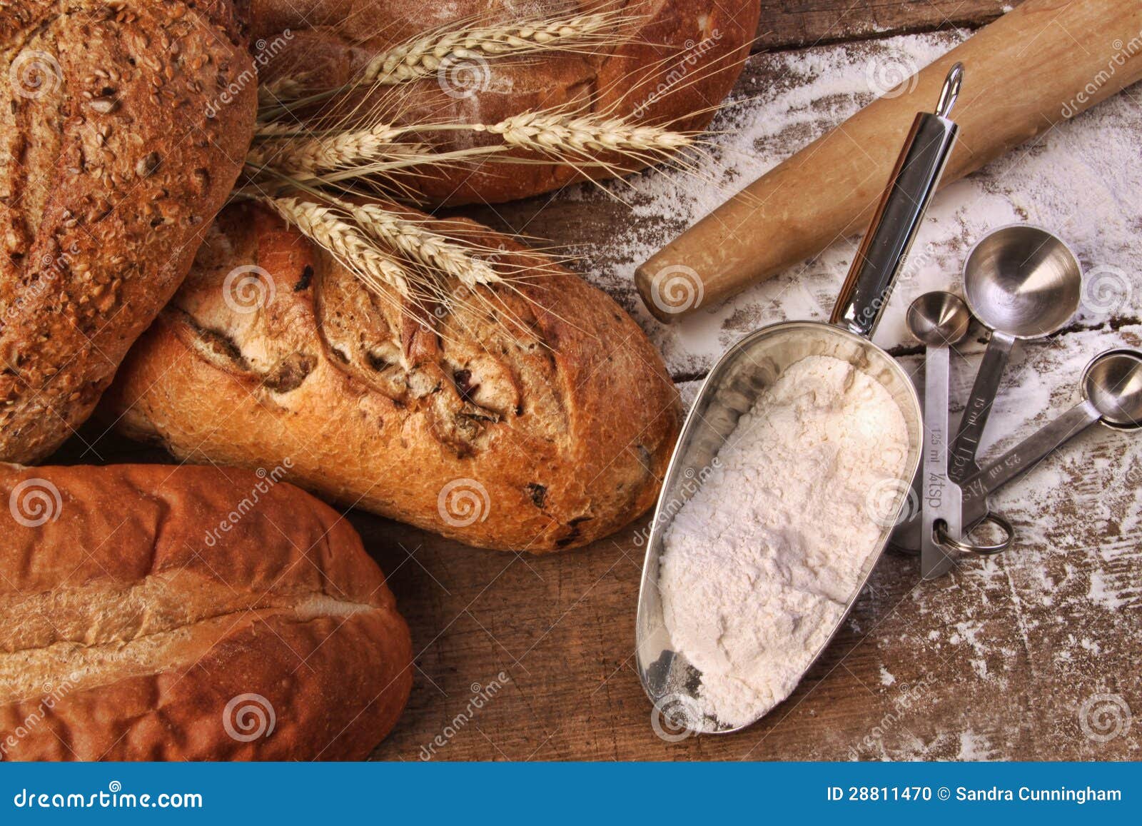 Assortment of Loaves of Bread with Flour Stock Photo - Image of ...