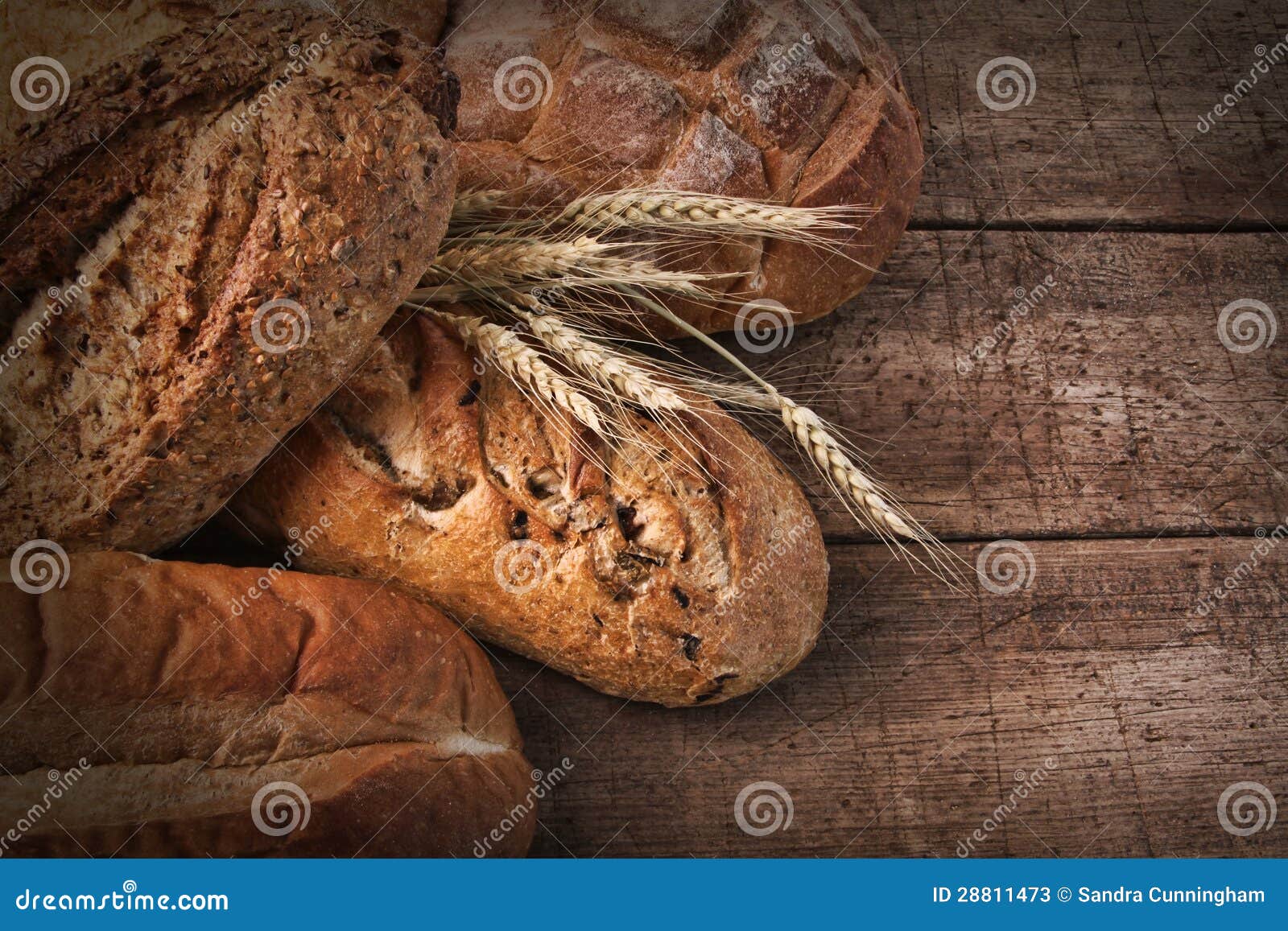 Assortment of Loaves of Bread on Wood Stock Image - Image of culinary ...