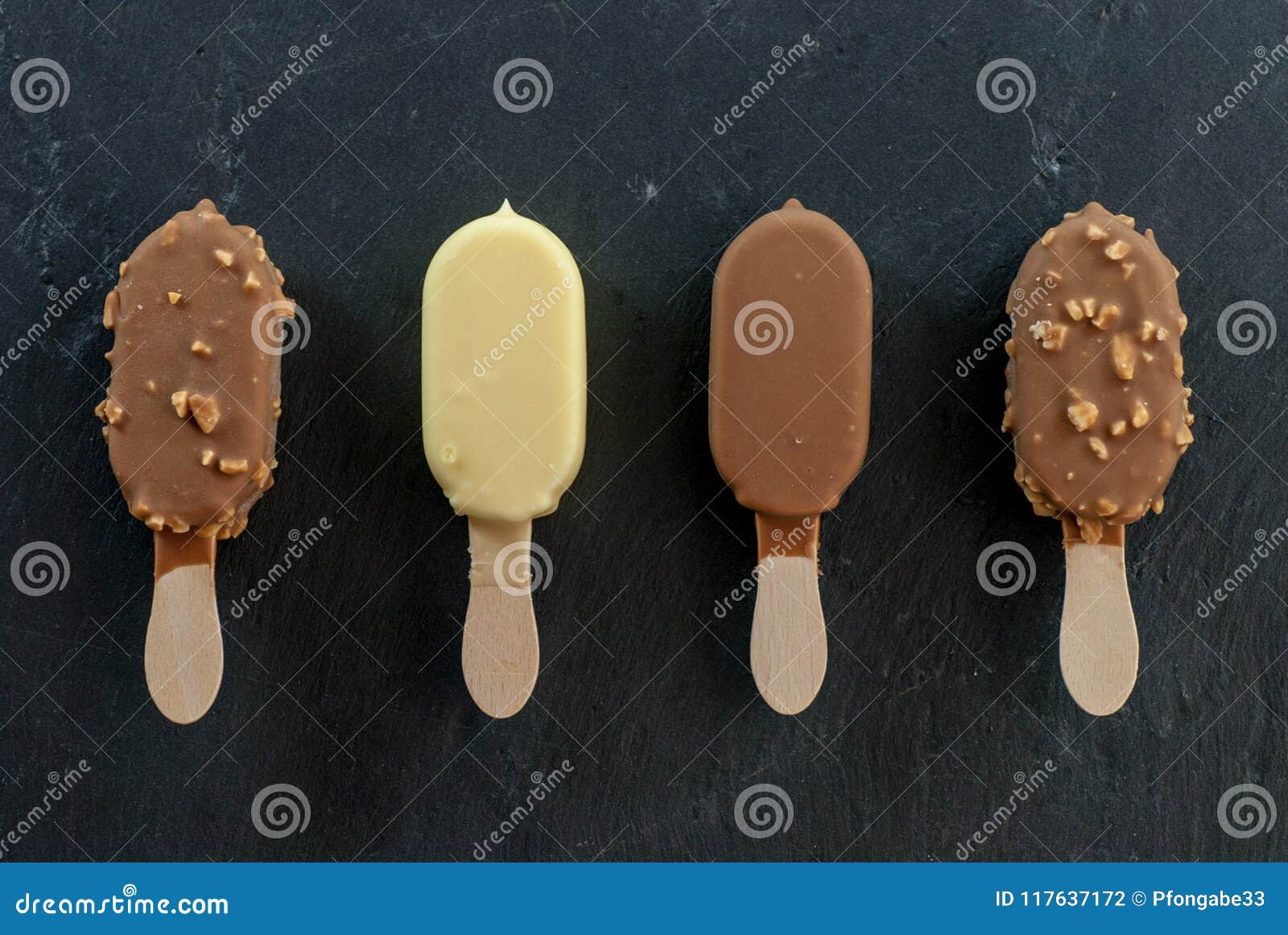 Assorted Mini Ice Creams on Stick on Black Stock Photo - Image of cold ...