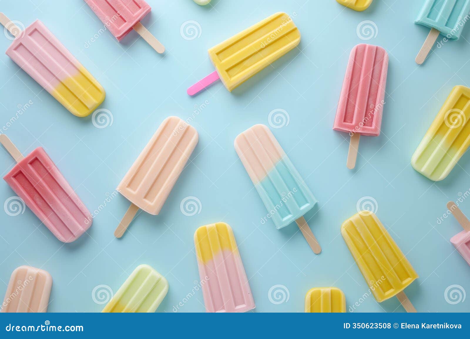 An Assortment of Pastel-colored Popsicles Laid Out in Rows on a Light ...