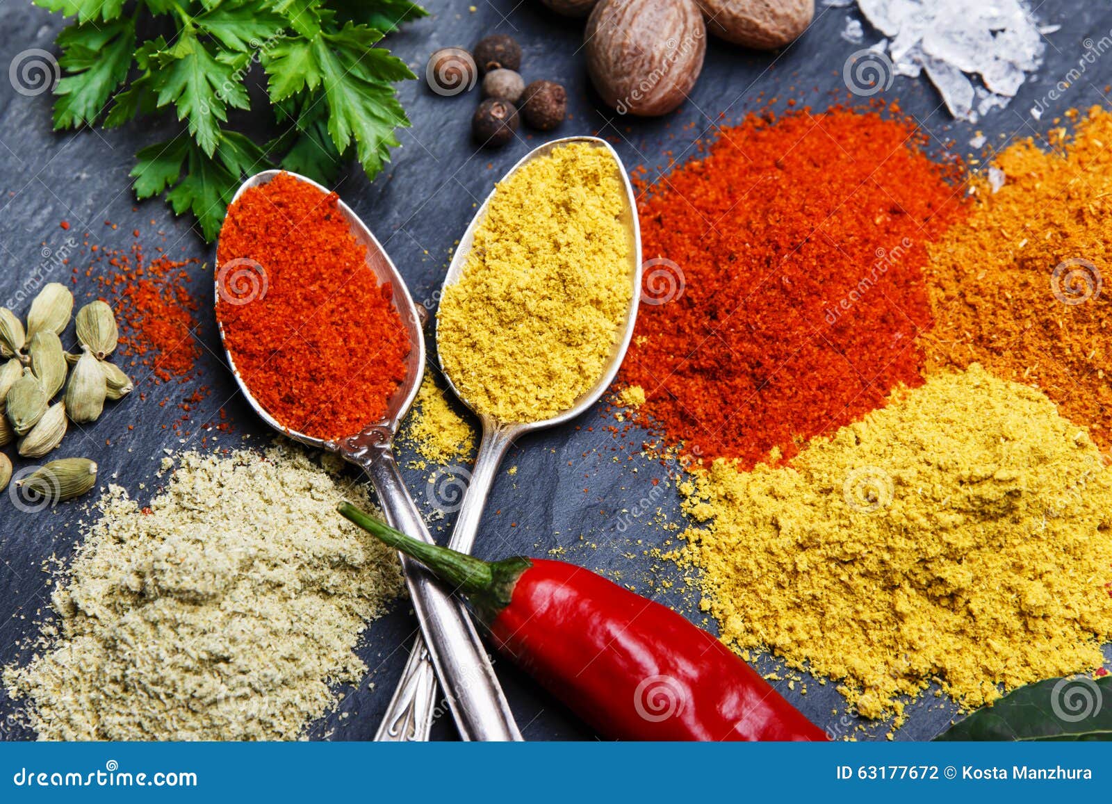 Assortment of Spices Seasoning on a Black Stone Stock Photo - Image of ...