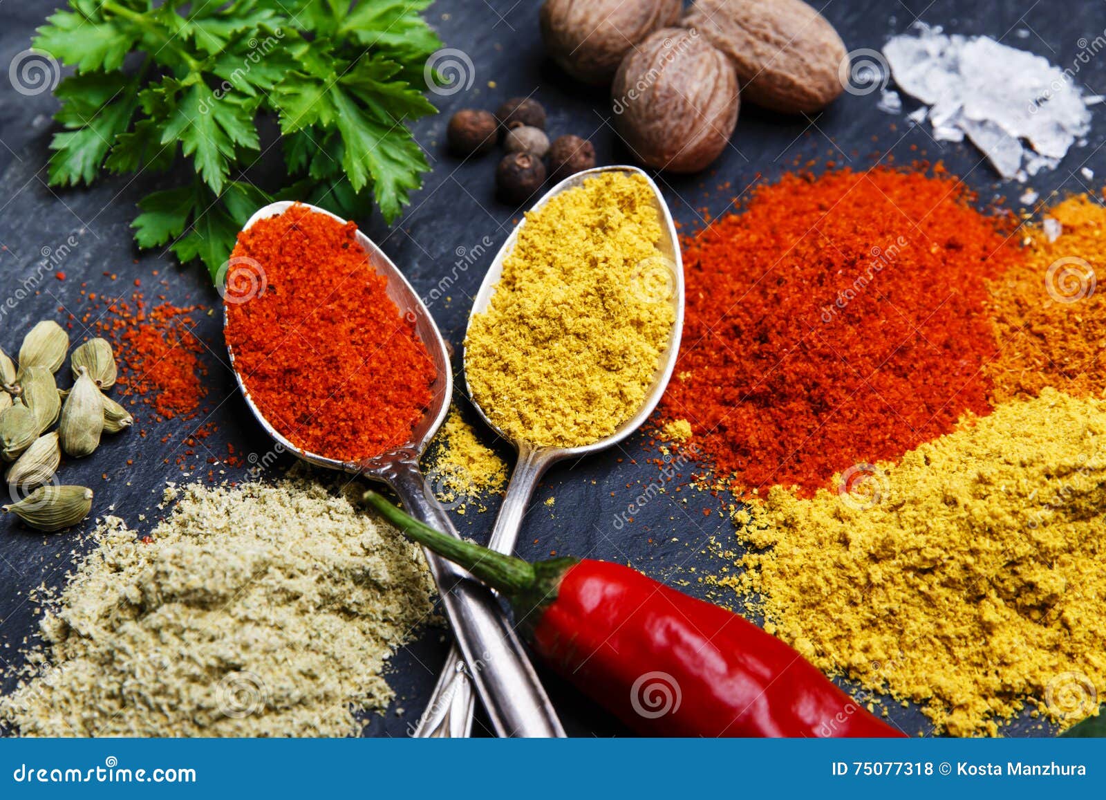 Assortment of Spices Seasoning on a Black Stone Stock Photo - Image of ...