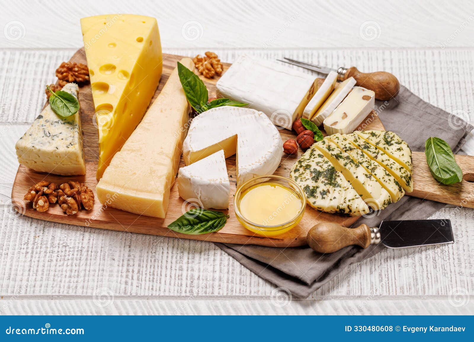 An Assortment of Various Cheeses Arranged on a Board, Highlighting ...