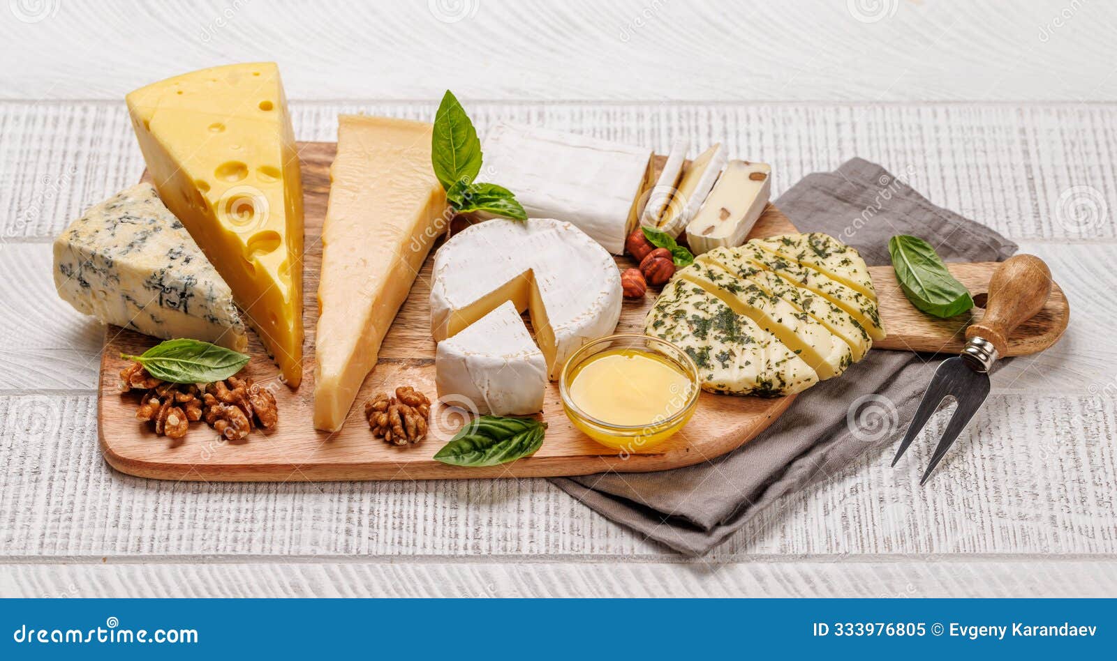 An Assortment of Various Cheeses Arranged on a Board, Highlighting ...
