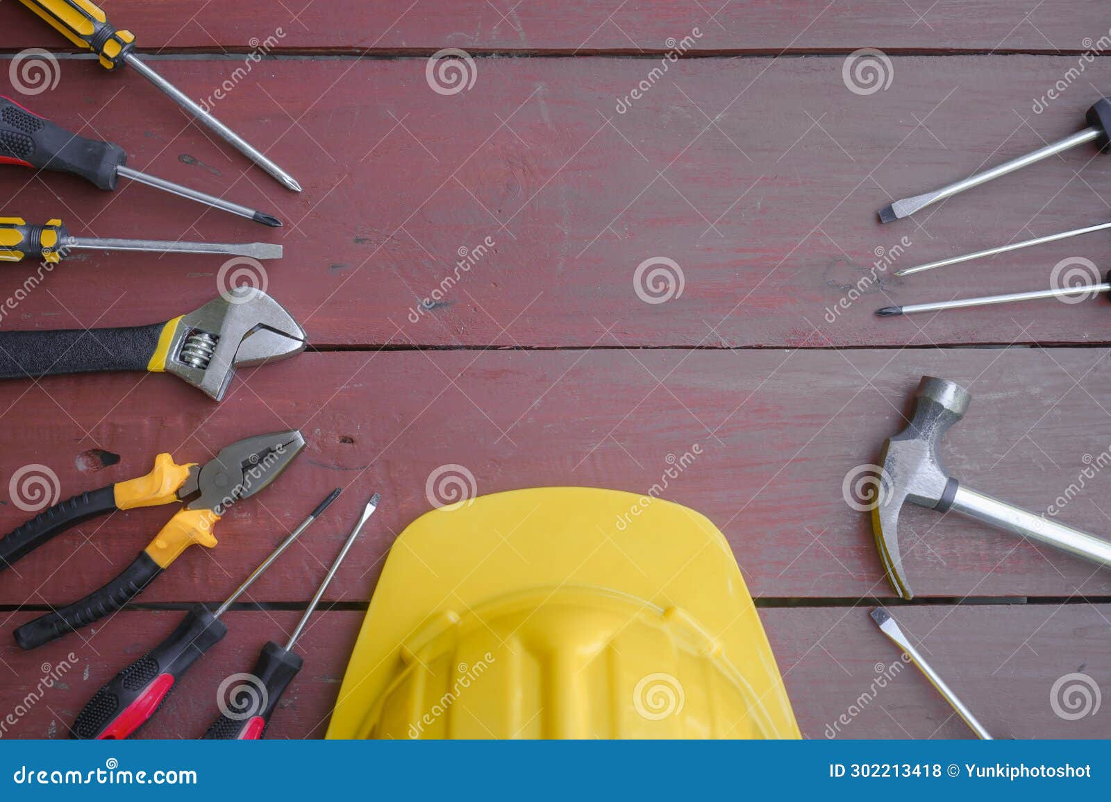 Assortment of Well-used Hand Tools Spread Out on a Worn Wooden Surface ...