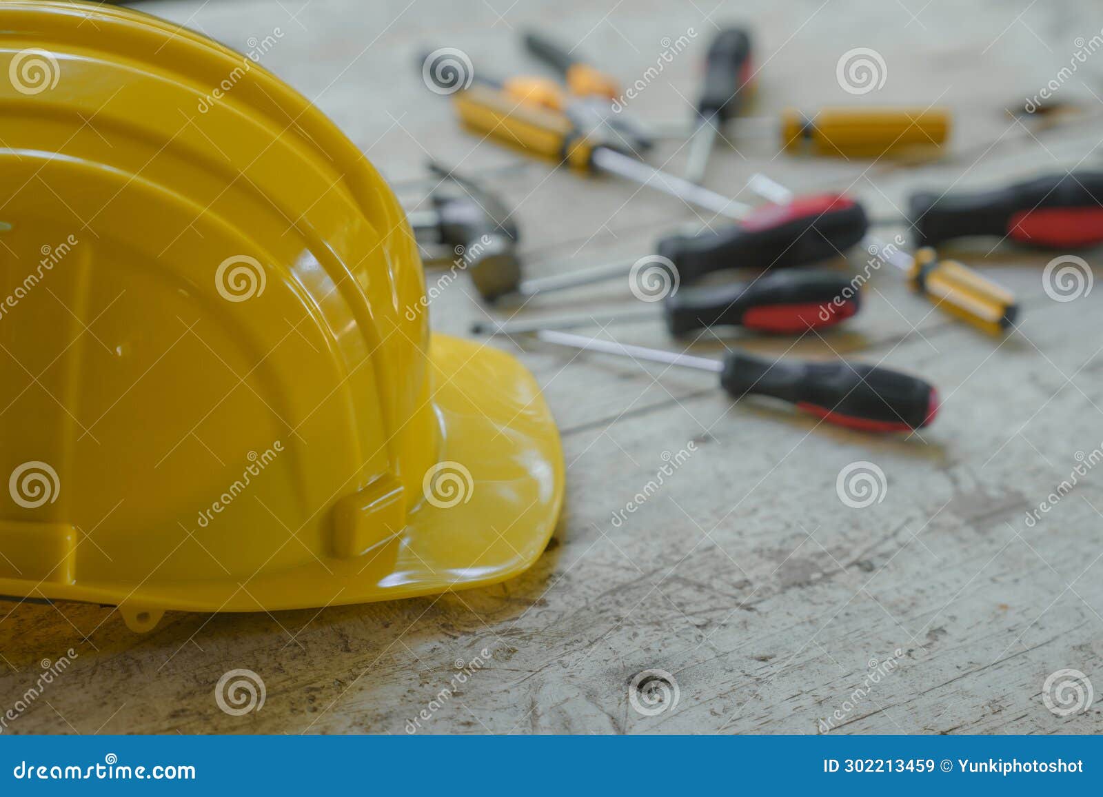 Assortment of Well-used Hand Tools Spread Out on a Worn Wooden Surface ...