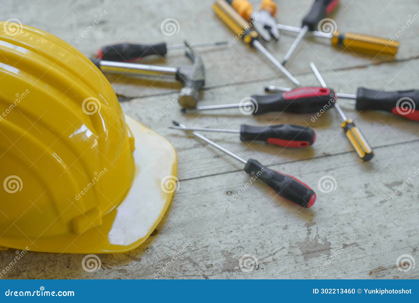 Assortment of Well-used Hand Tools Spread Out on a Worn Wooden Surface ...