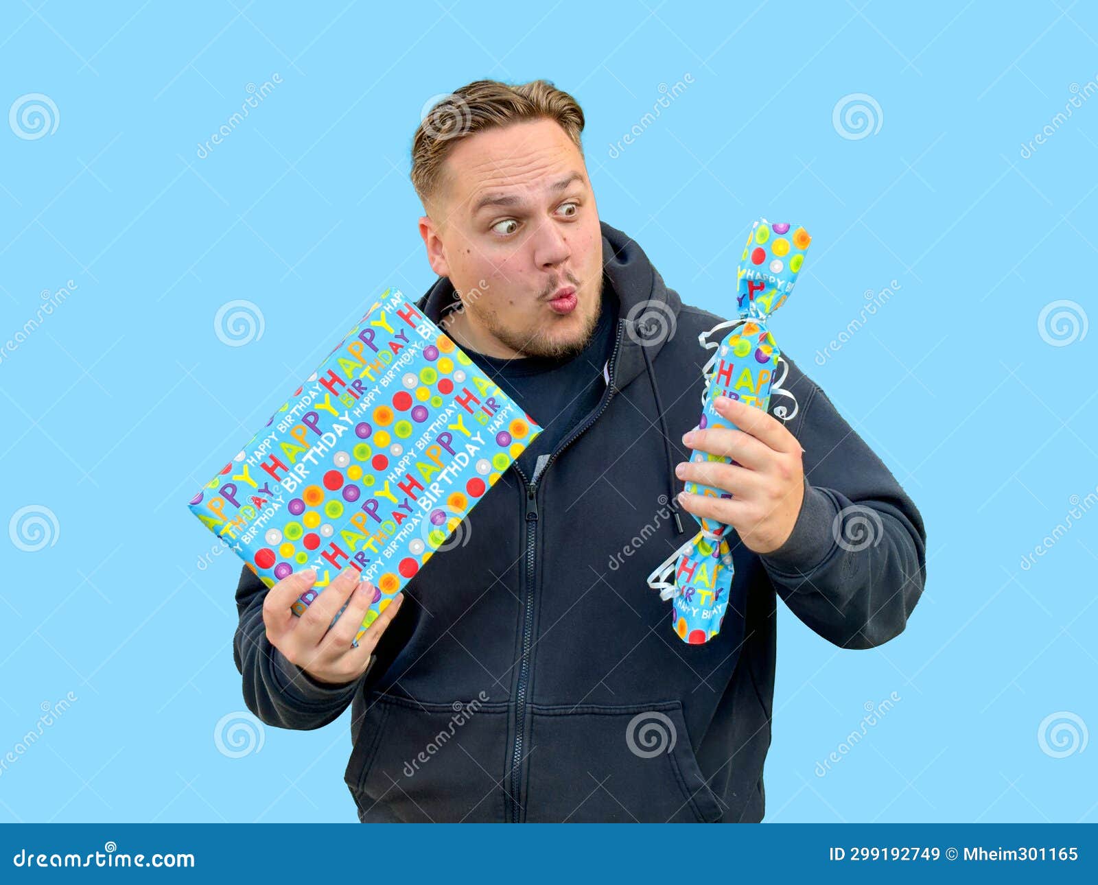 Astonished Looking Man Holding Two Blue Boxes with Presents in Them ...