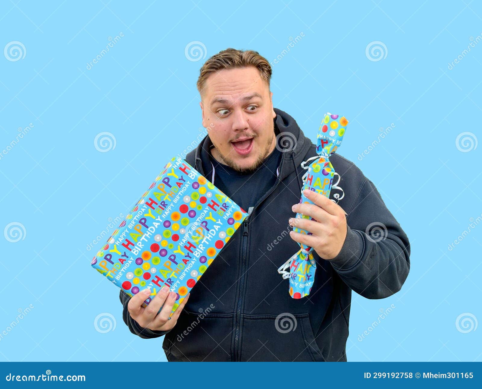 Astonished Looking Man Holding Two Blue Boxes with Presents in Them ...