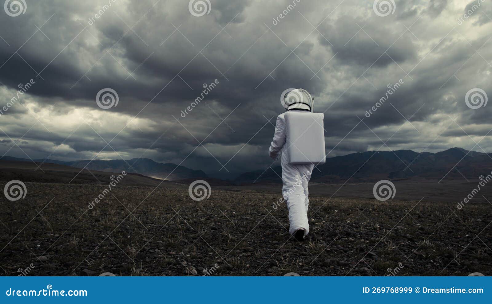 Astronaut Explores an Unknown Red Planet. Cloudy Sky and Mountains in ...