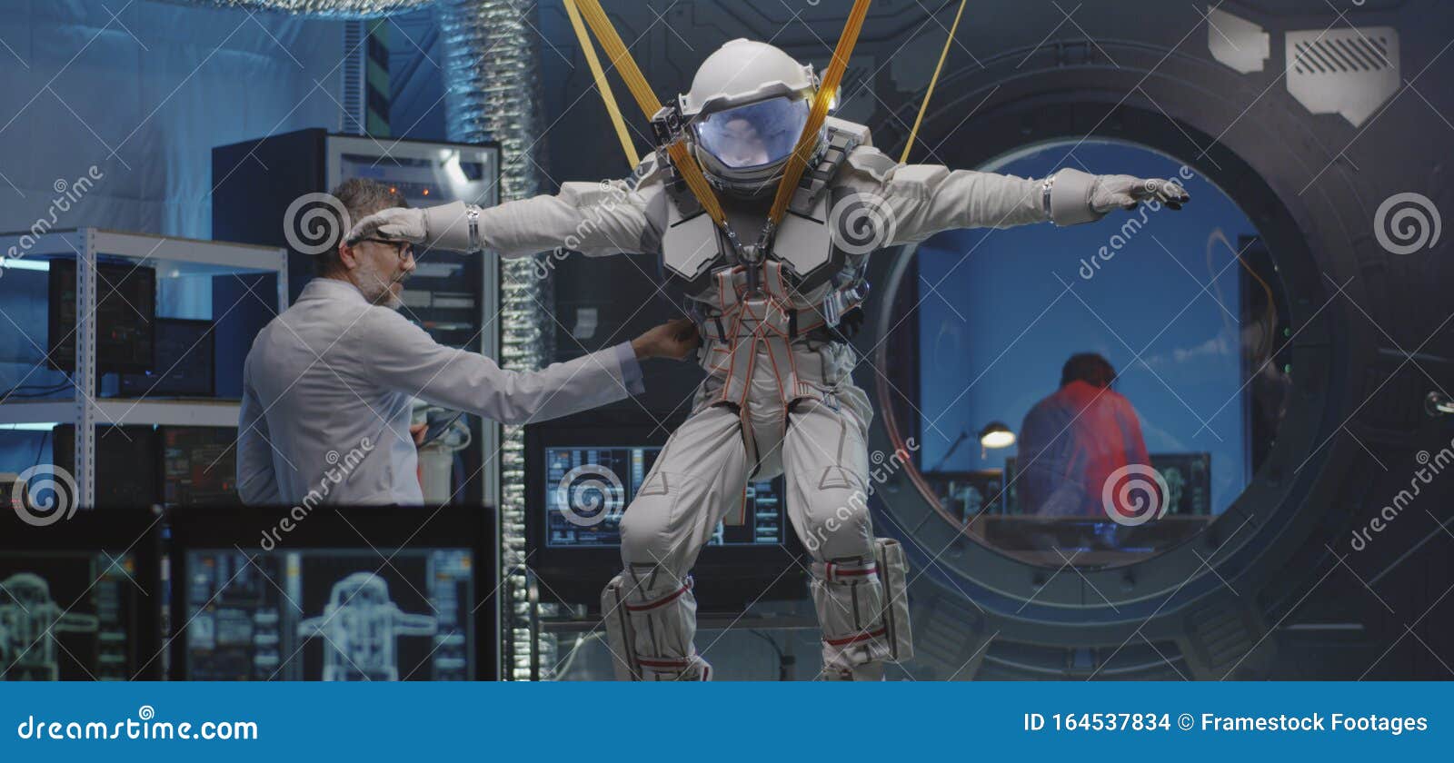 Astronaut Moving Limbs while Hanging on Bands Stock Photo - Image of ...