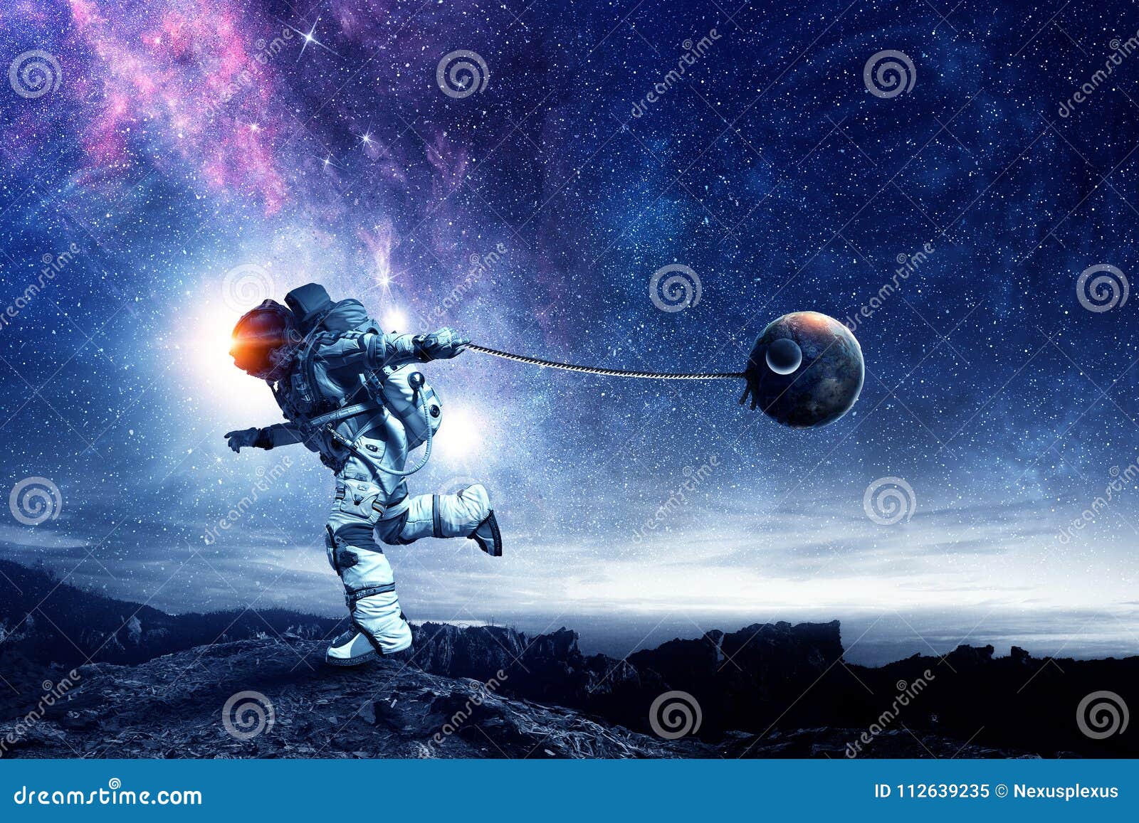 Fantasy Image with Spaceman Catch Planet. Mixed Media Stock Image ...