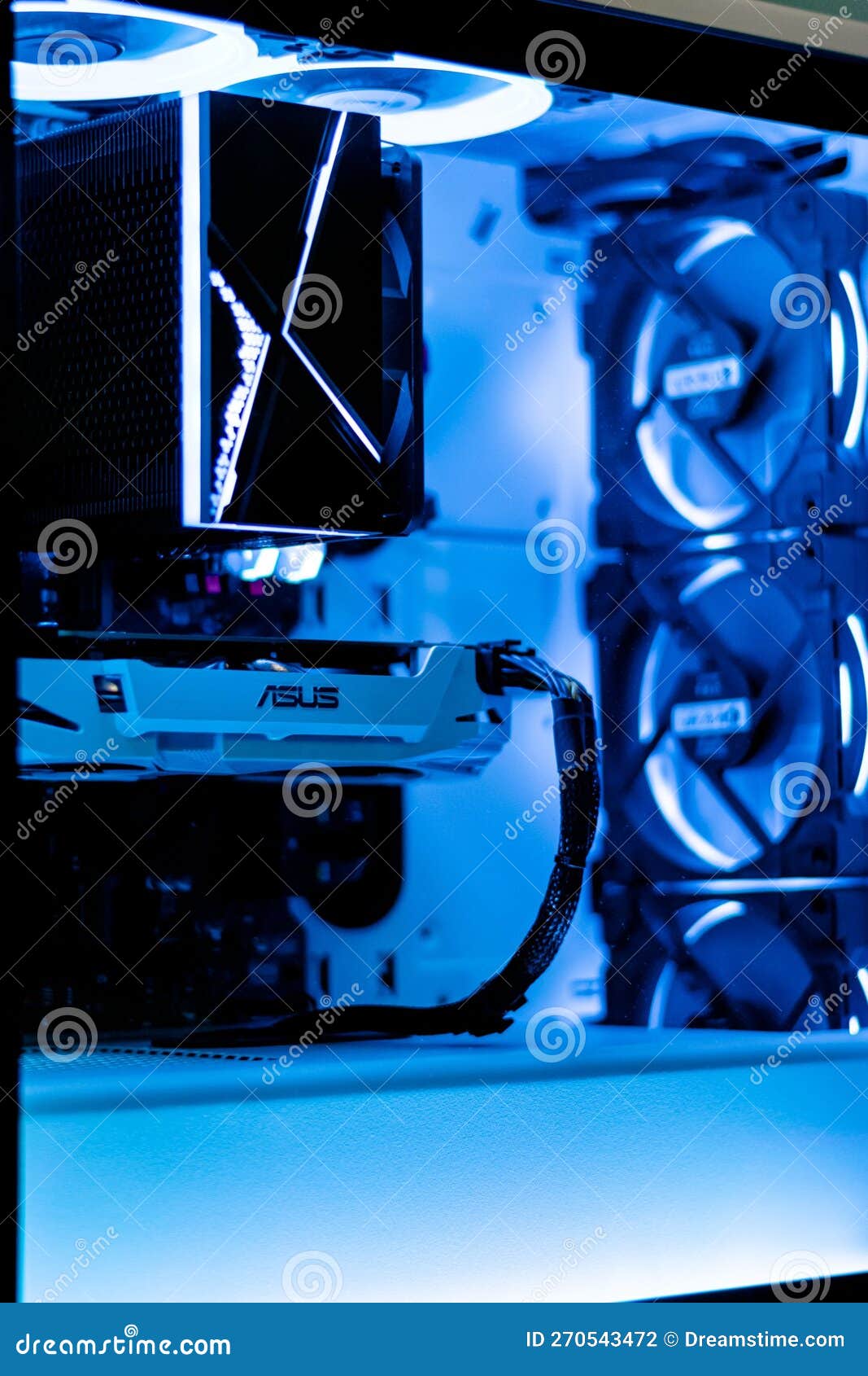 ASUS Computer on a Desk, with a Cooling Fan Providing Ventilation ...