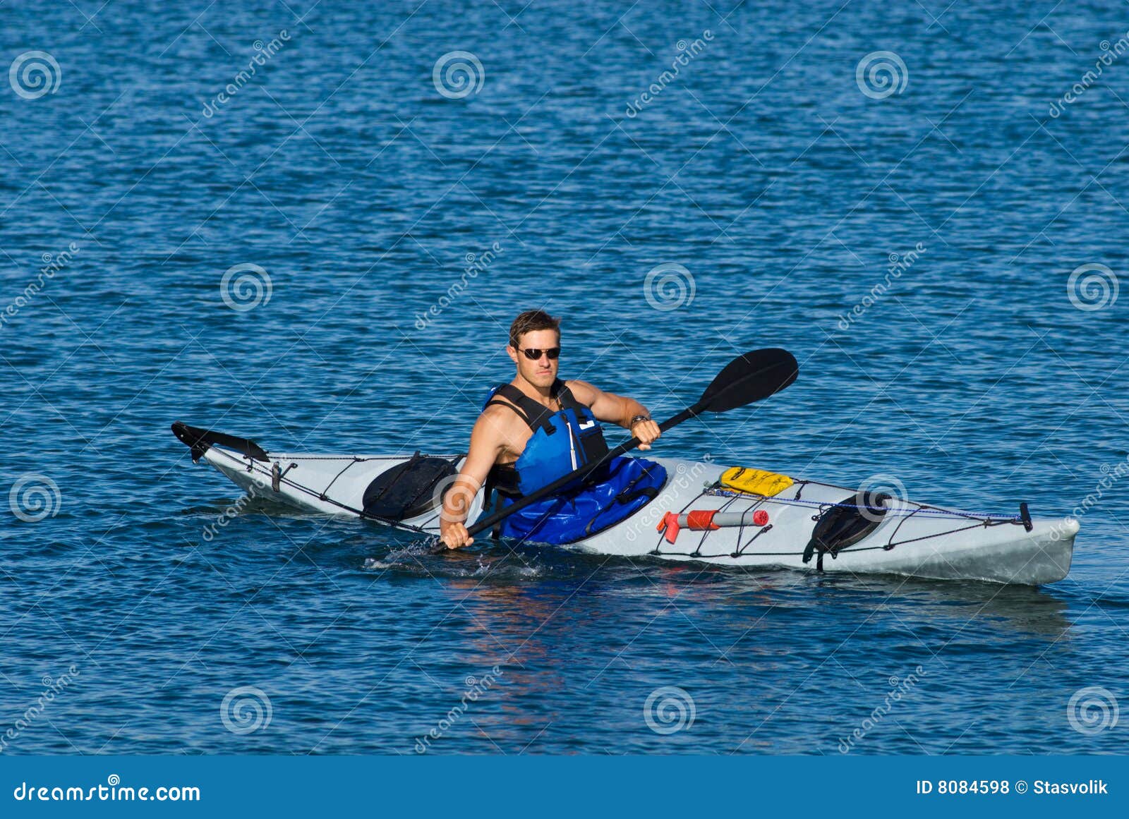 Atheltic Man in a Sea Kayak Stock Photo - Image of male, mission: 8084598