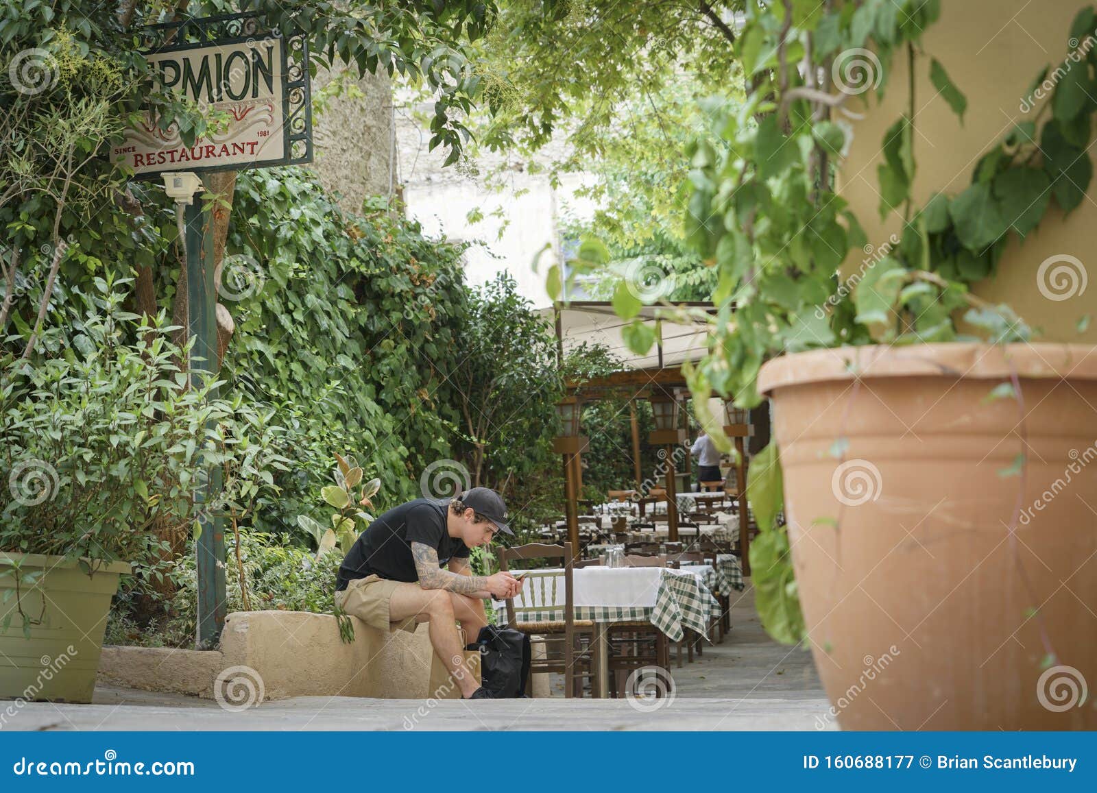 Man Sitting on Step Using Mobile Editorial Photography - Image of ...