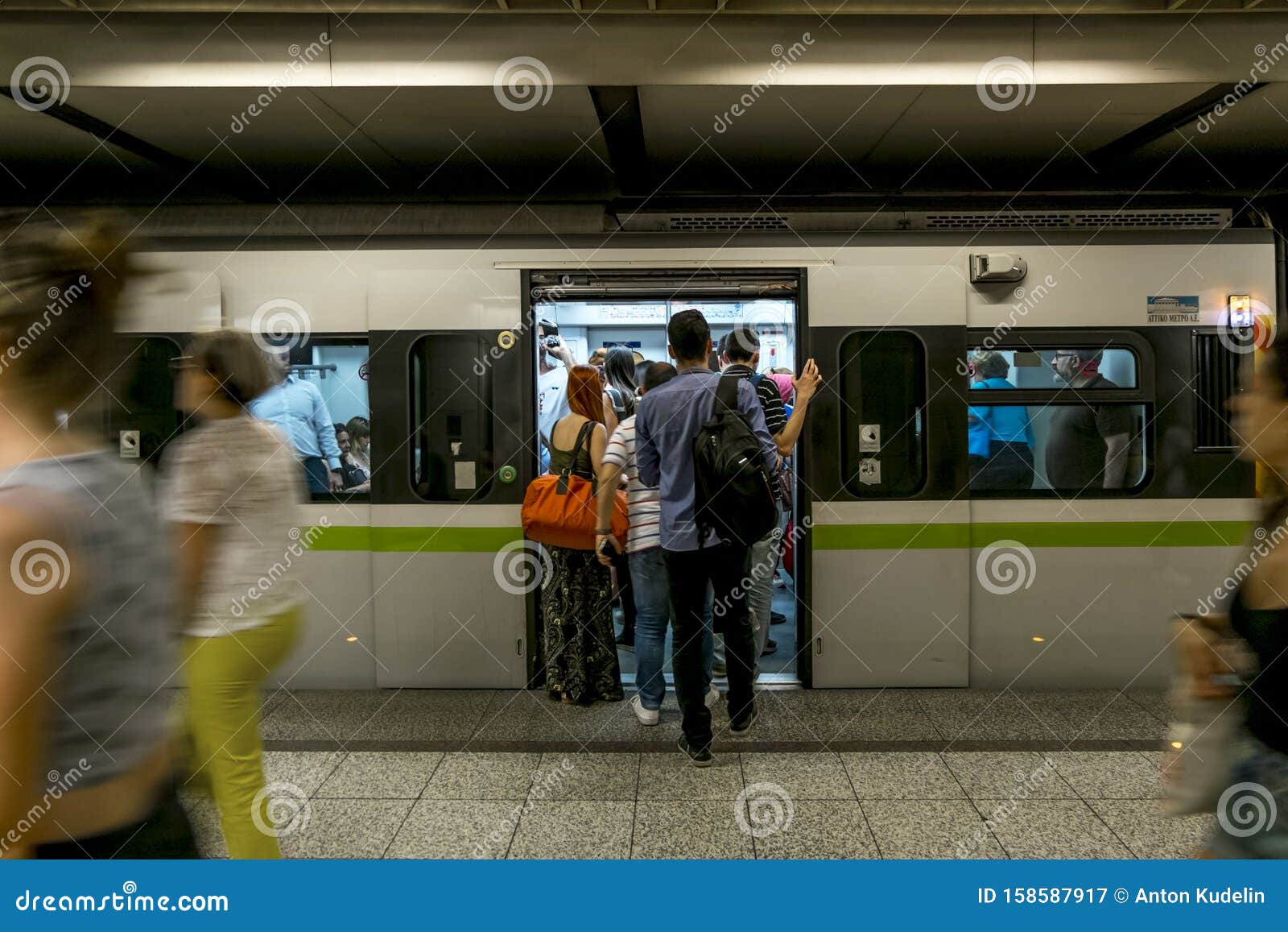 Passengers Board a Train at the Acropolis Metro Station Platform in ...