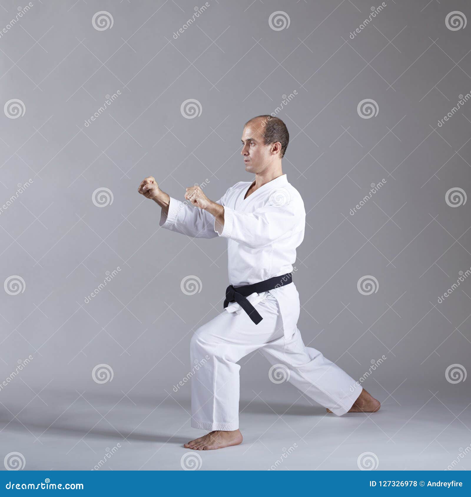 An Athlete with a Black Belt and in Karategi Performs a Formal Karate ...