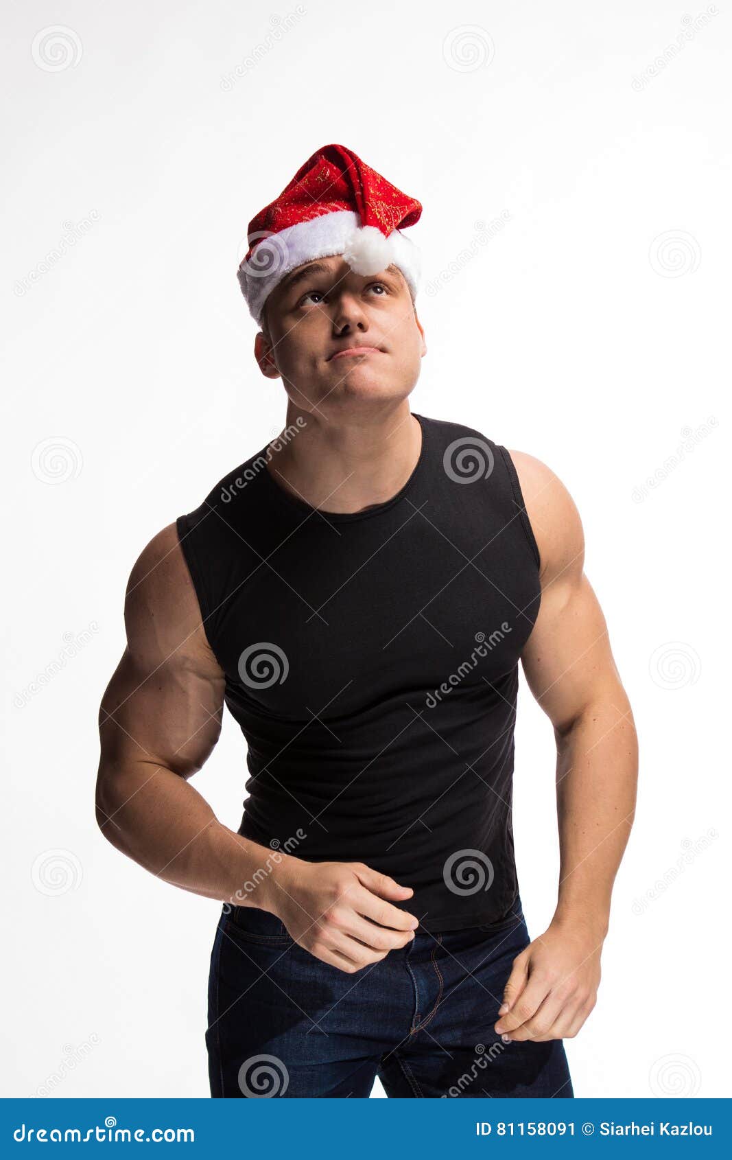 Athlete Bodybuilder Posing with a Beard and a Cap of Santa Claus Stock ...