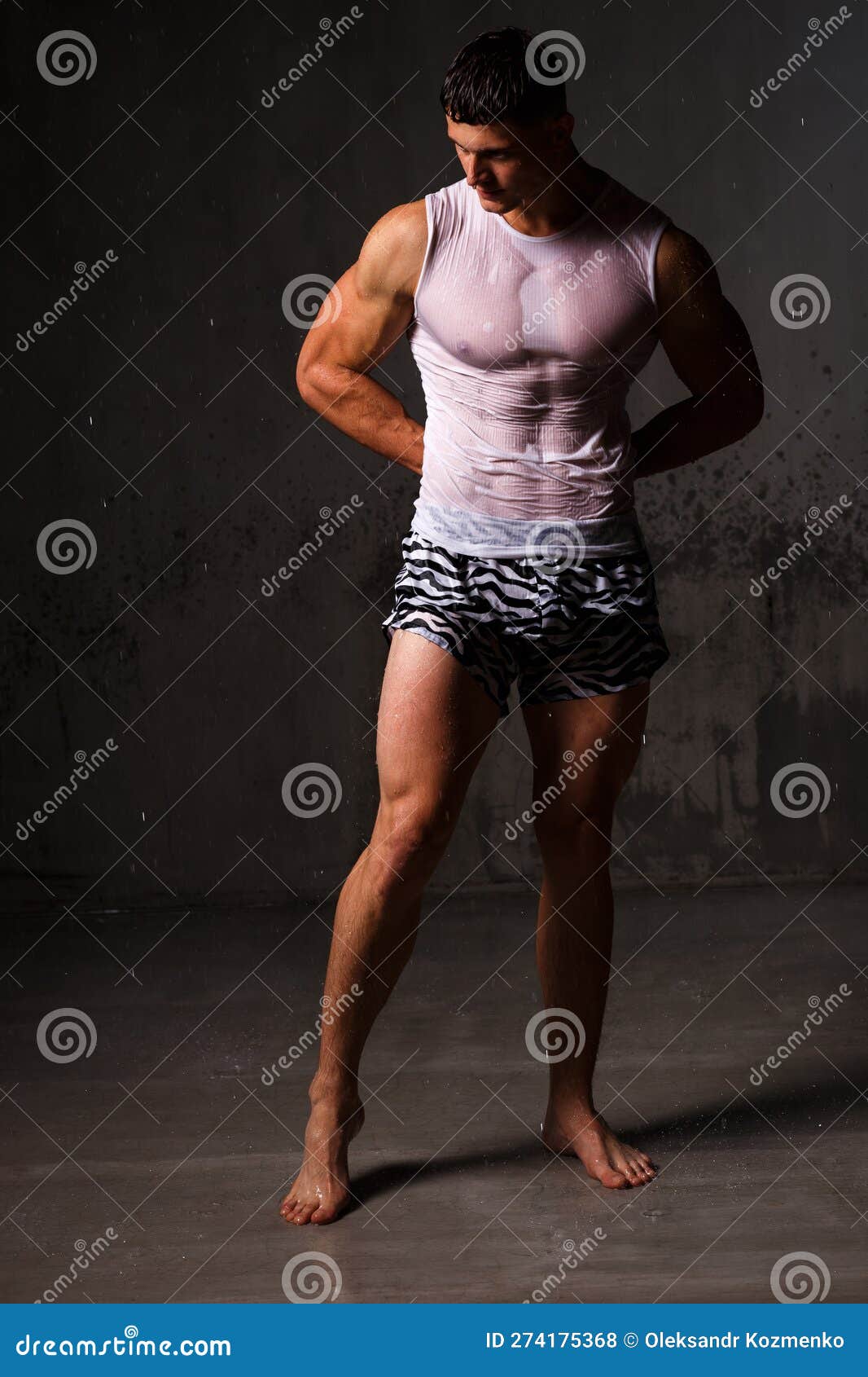 Athlete Bodybuilder Trains in the Studio in the Rain. Stock Photo ...