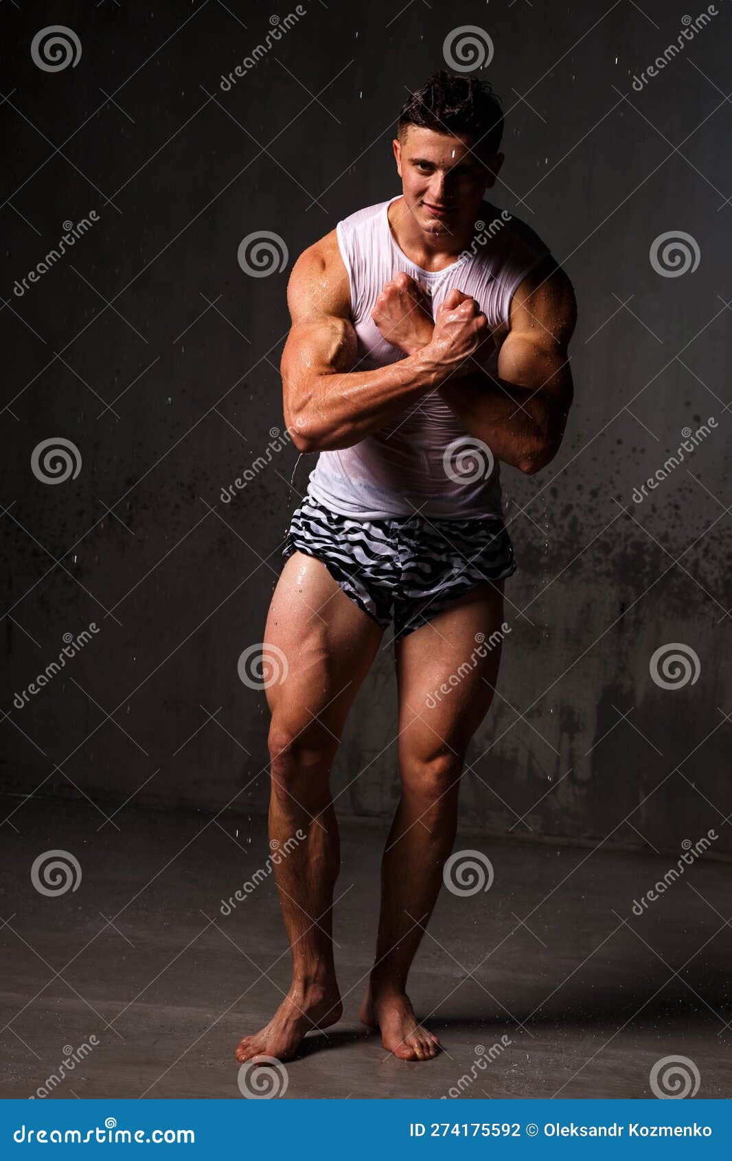 Athlete Bodybuilder Trains in the Studio in the Rain. Stock Photo ...