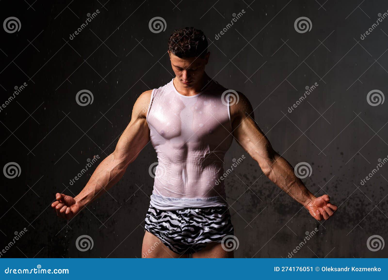 Athlete Bodybuilder Trains in the Studio in the Rain. Stock Image ...