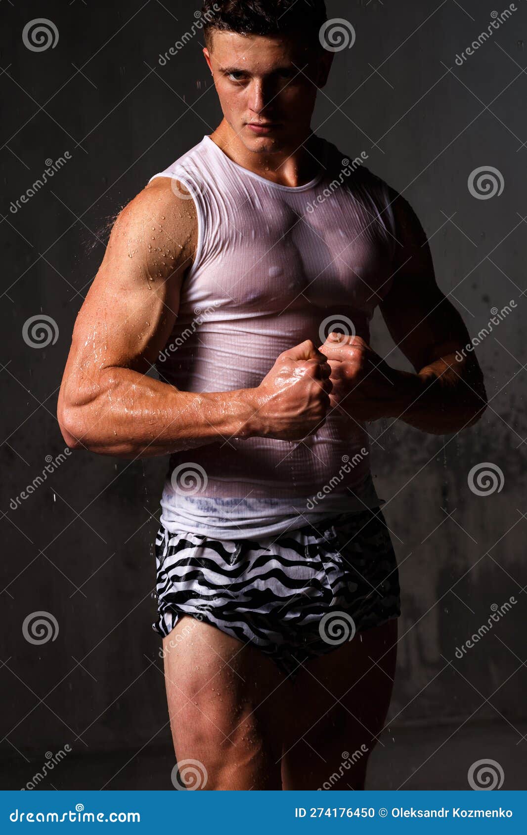 Athlete Bodybuilder Trains in the Studio in the Rain. Stock Photo ...