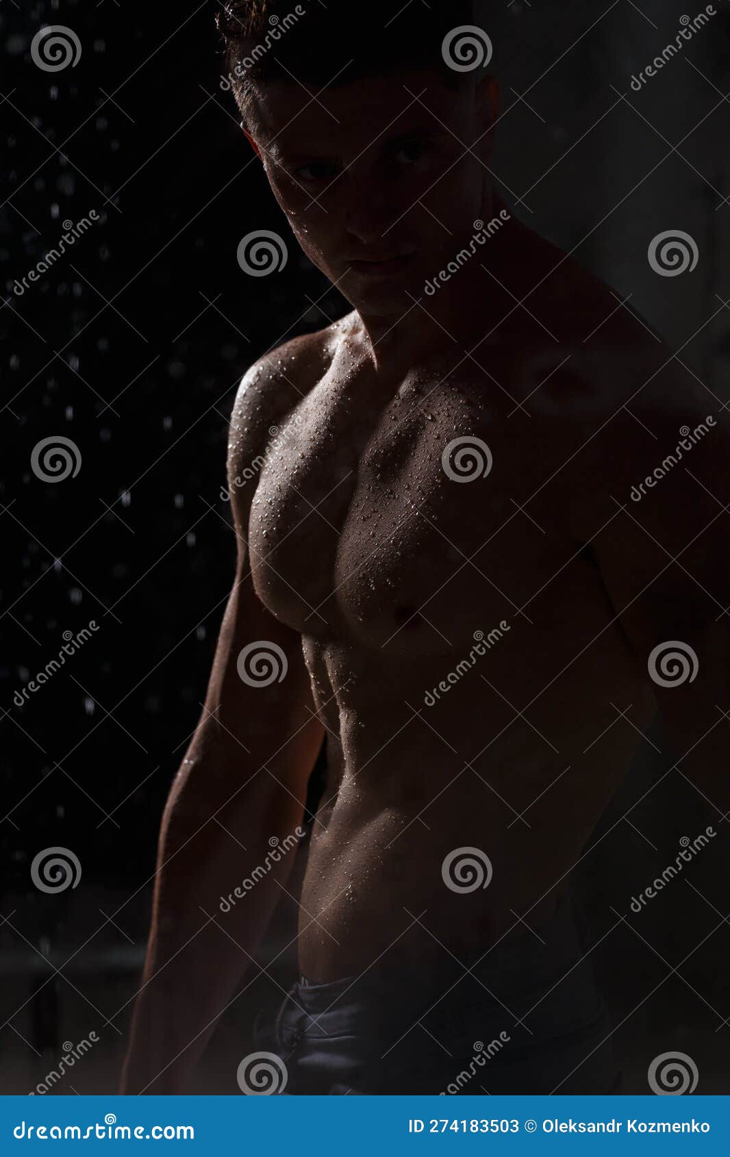 Athlete Bodybuilder Trains in the Studio in the Rain. Stock Image ...