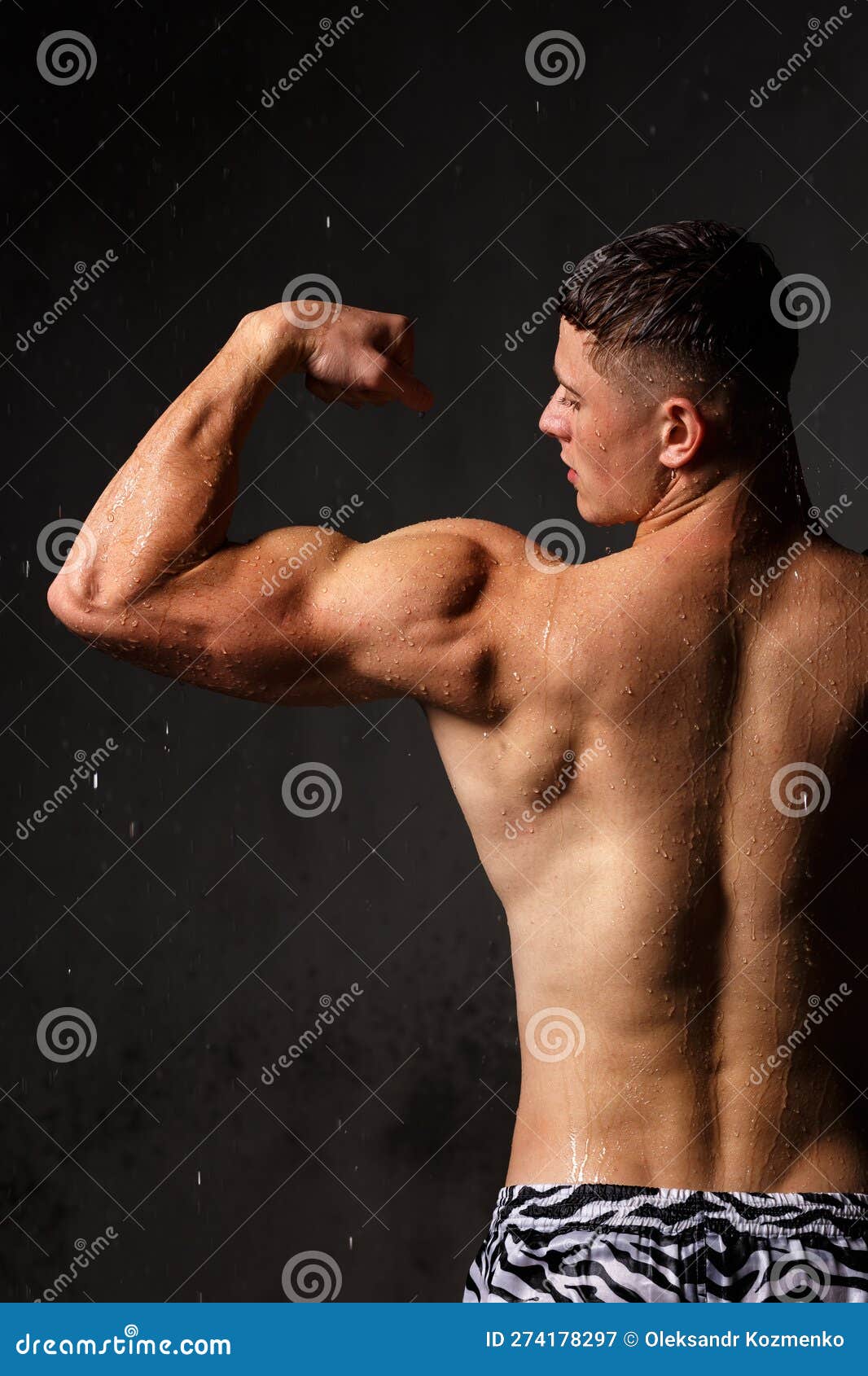 Athlete Bodybuilder Trains in the Studio in the Rain. Stock Image ...