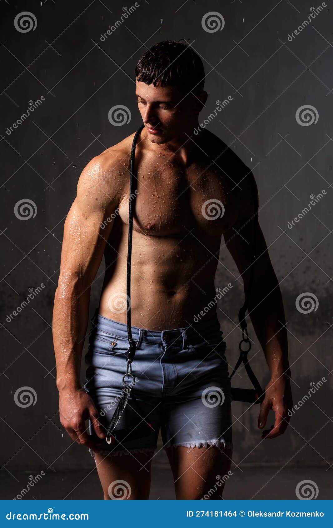 Athlete Bodybuilder Trains in the Studio in the Rain. Stock Photo ...