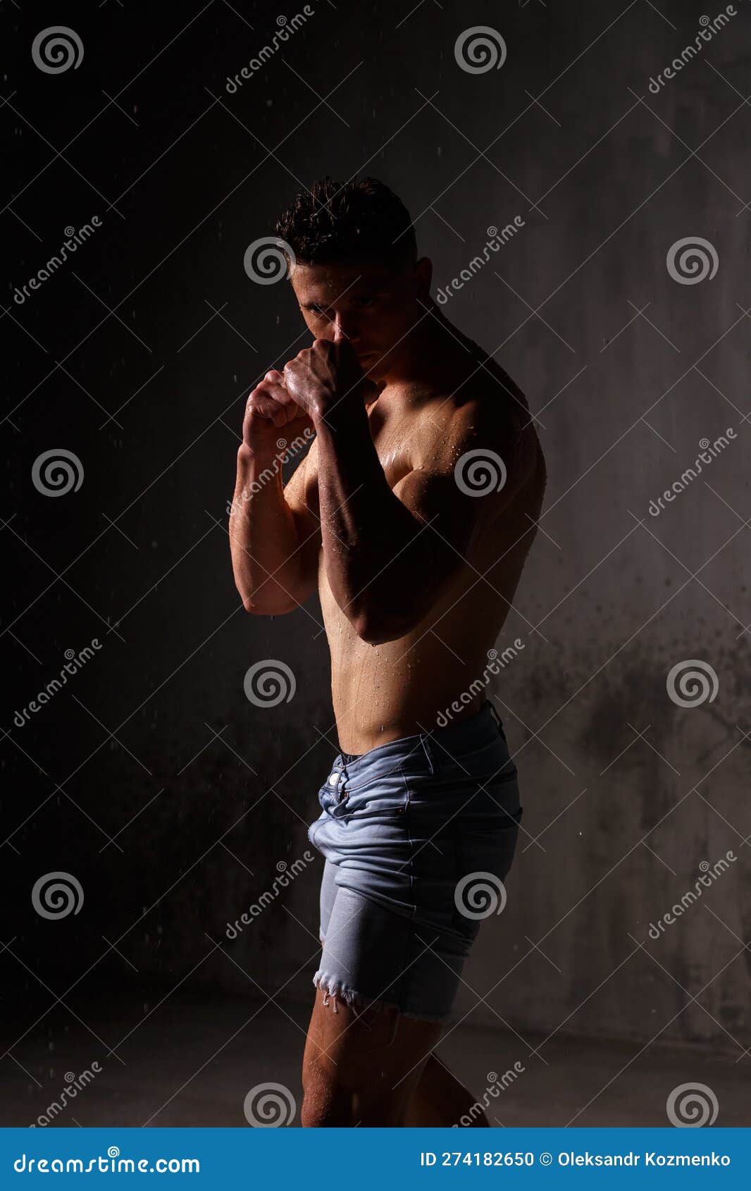 Athlete Bodybuilder Trains in the Studio in the Rain. Stock Photo ...