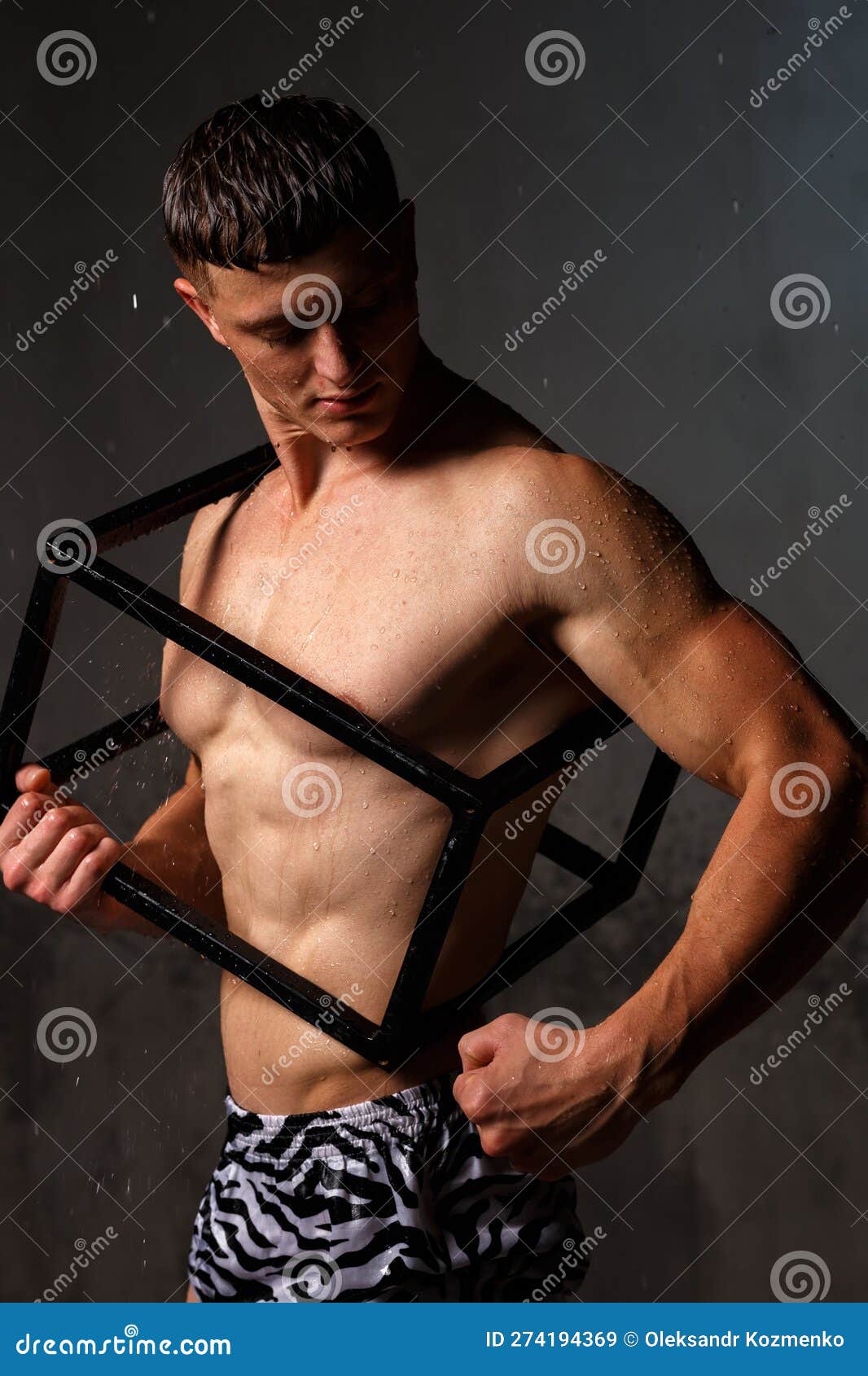 Athlete Bodybuilder Trains in the Studio in the Rain. Stock Image ...