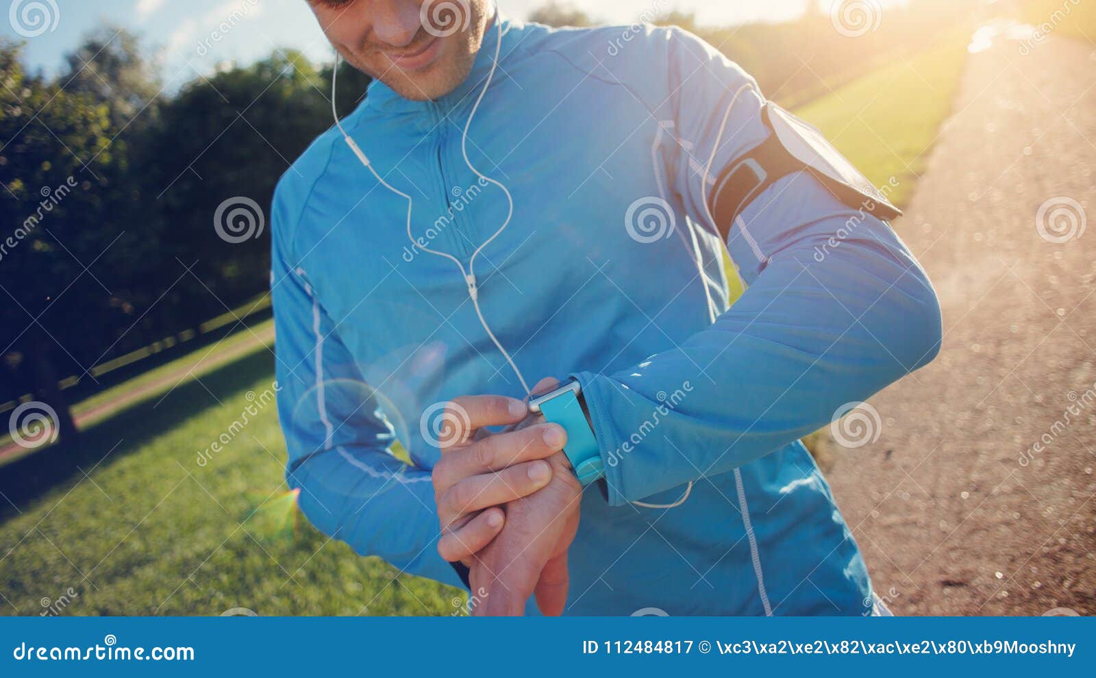 Athlete Checking the Program at His Smart Watch before Running Stock ...