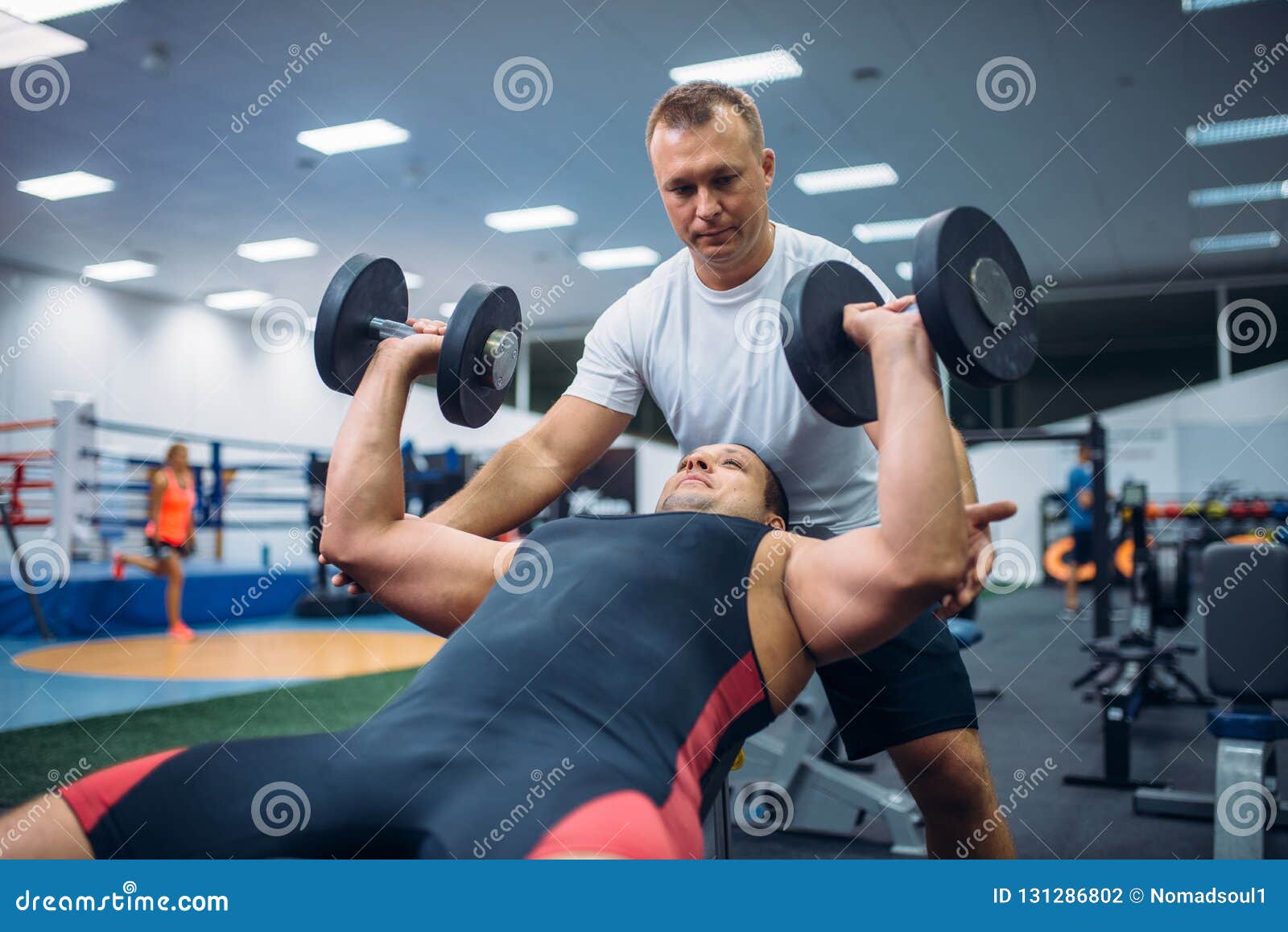 Athlete Doing Exercise Under Instructor Control Stock Photo - Image of ...