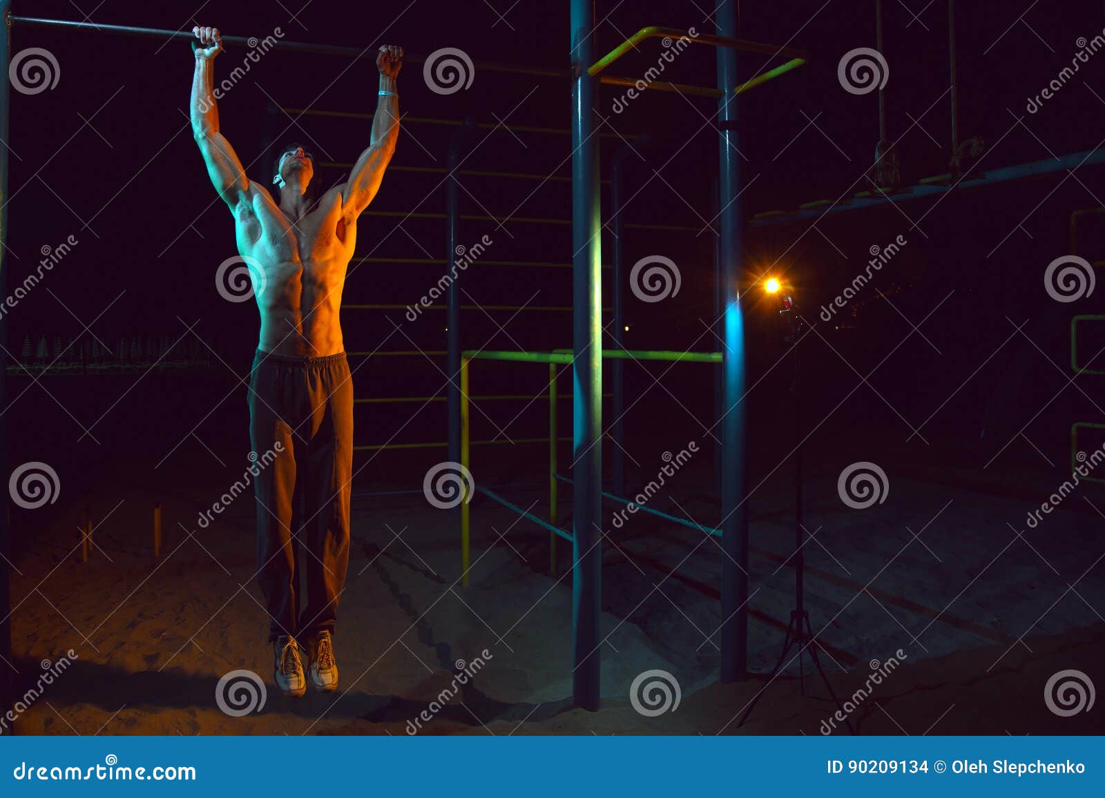 Athlete Doing Exercises on the Horizontal Bar Stock Photo - Image of ...