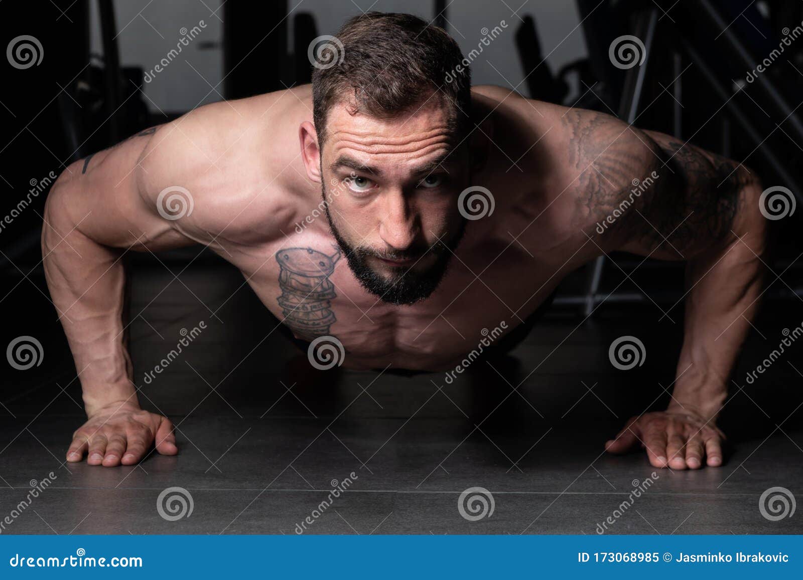 Man Doing Press Ups in Gym stock image. Image of competition - 173068985