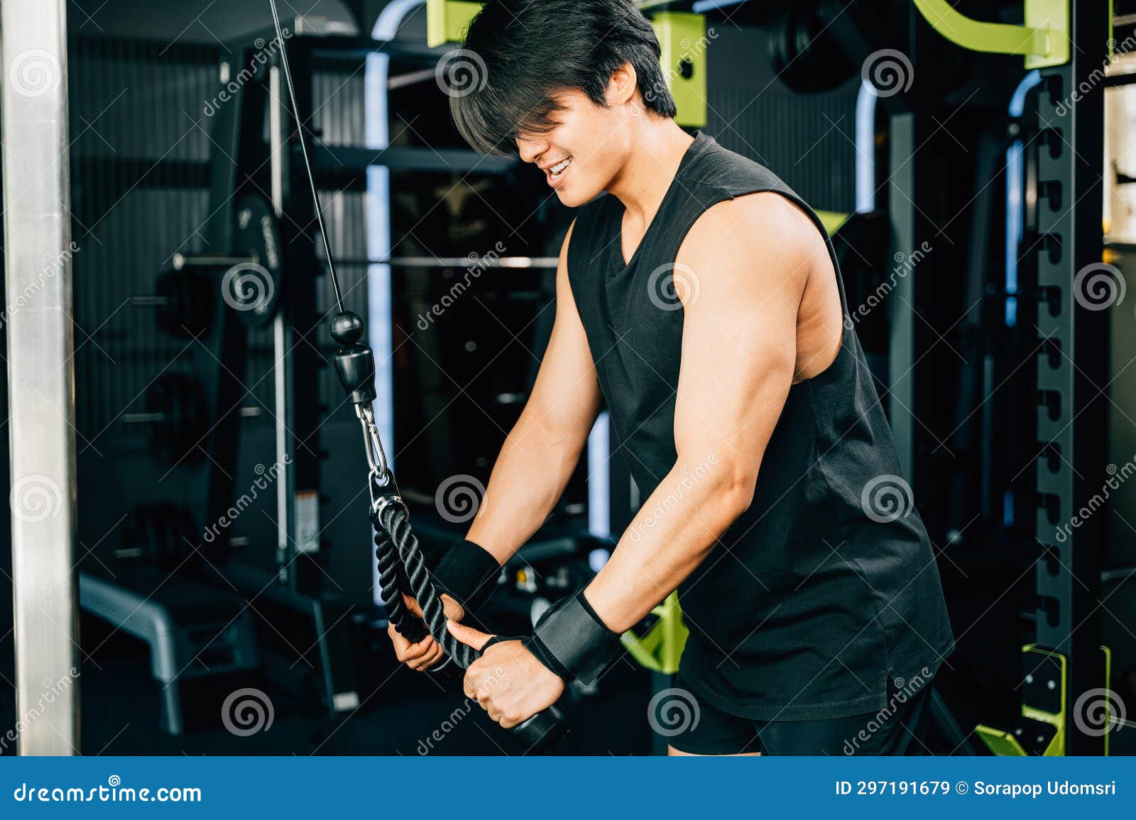 Young Man Performing Cable Triceps Pulldowns To Build Muscle and ...