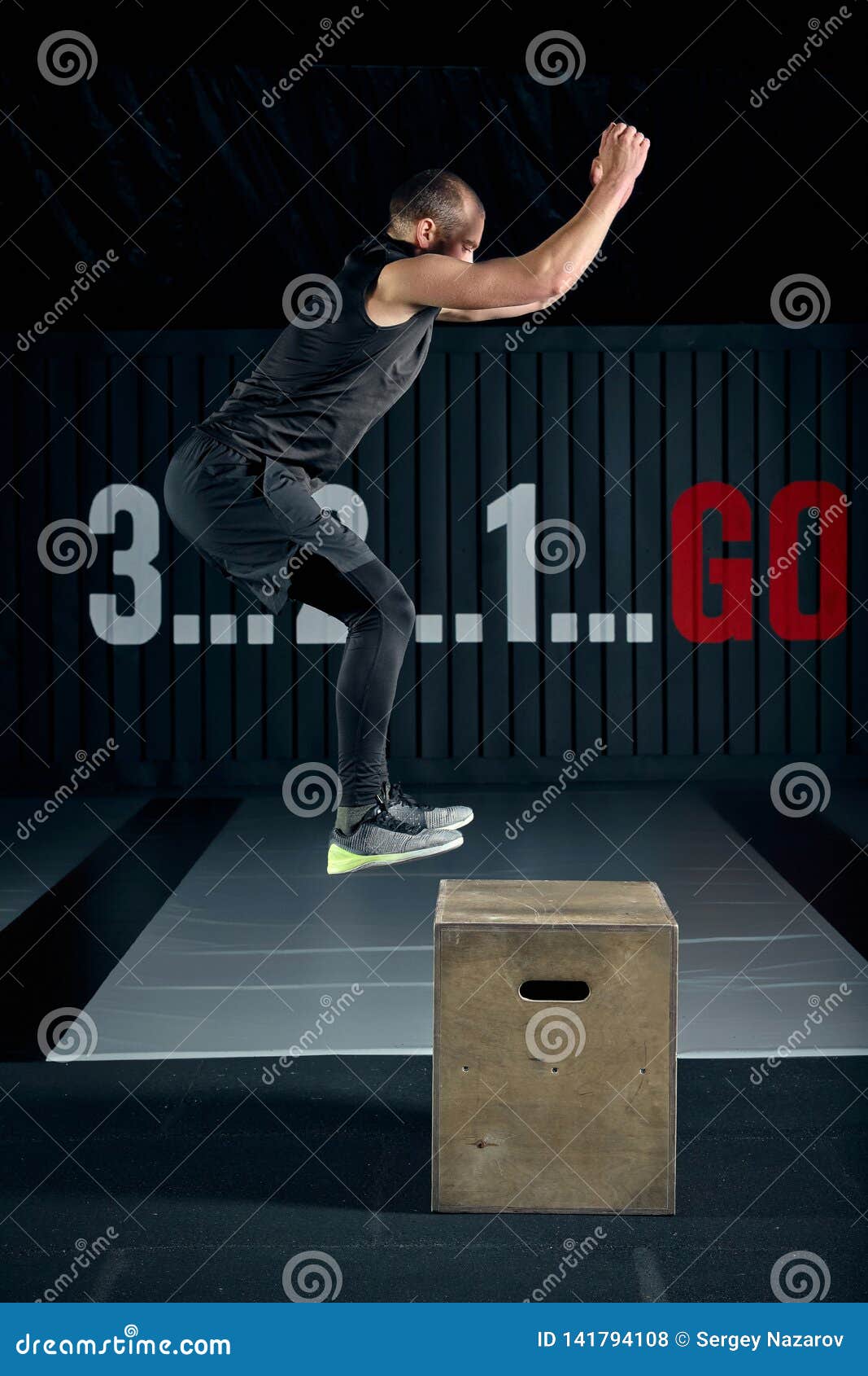 Athlete Gave Exercise. Jumping on the Box. Phase Touchdown. Studio ...