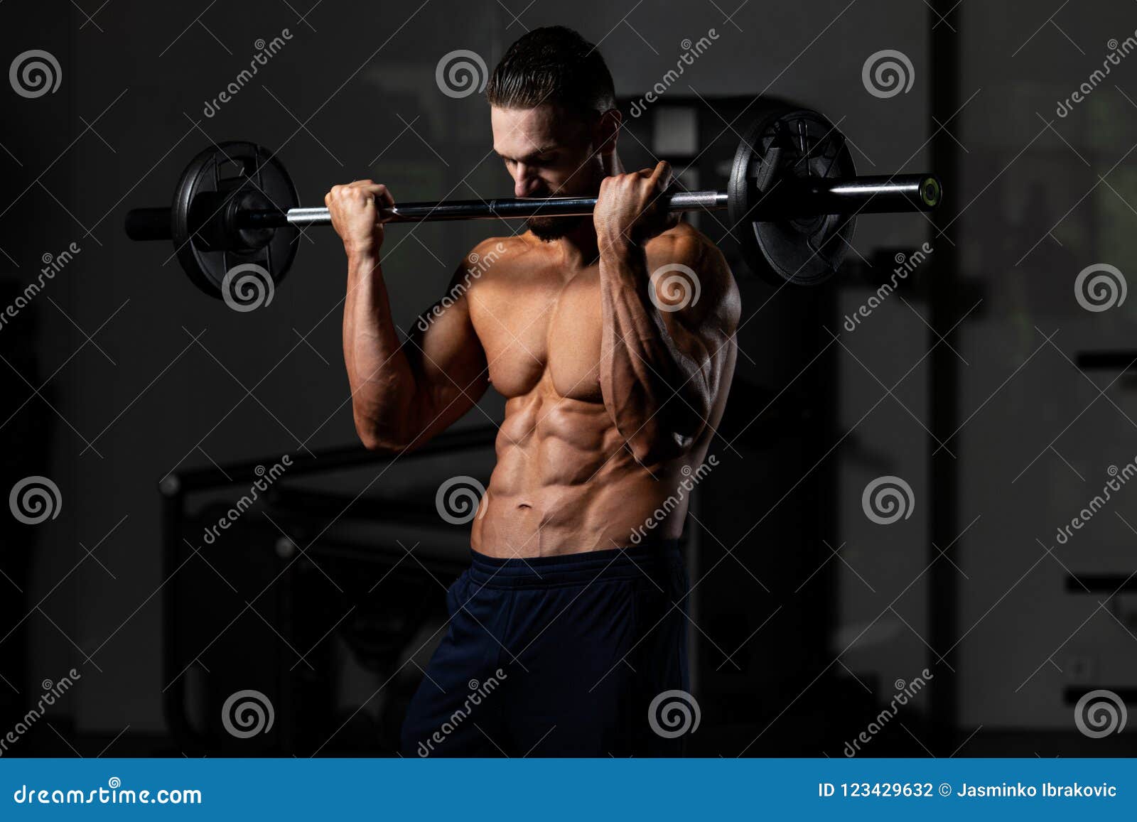 Biceps Exercise with Barbell Stock Photo - Image of muscular, caucasian ...