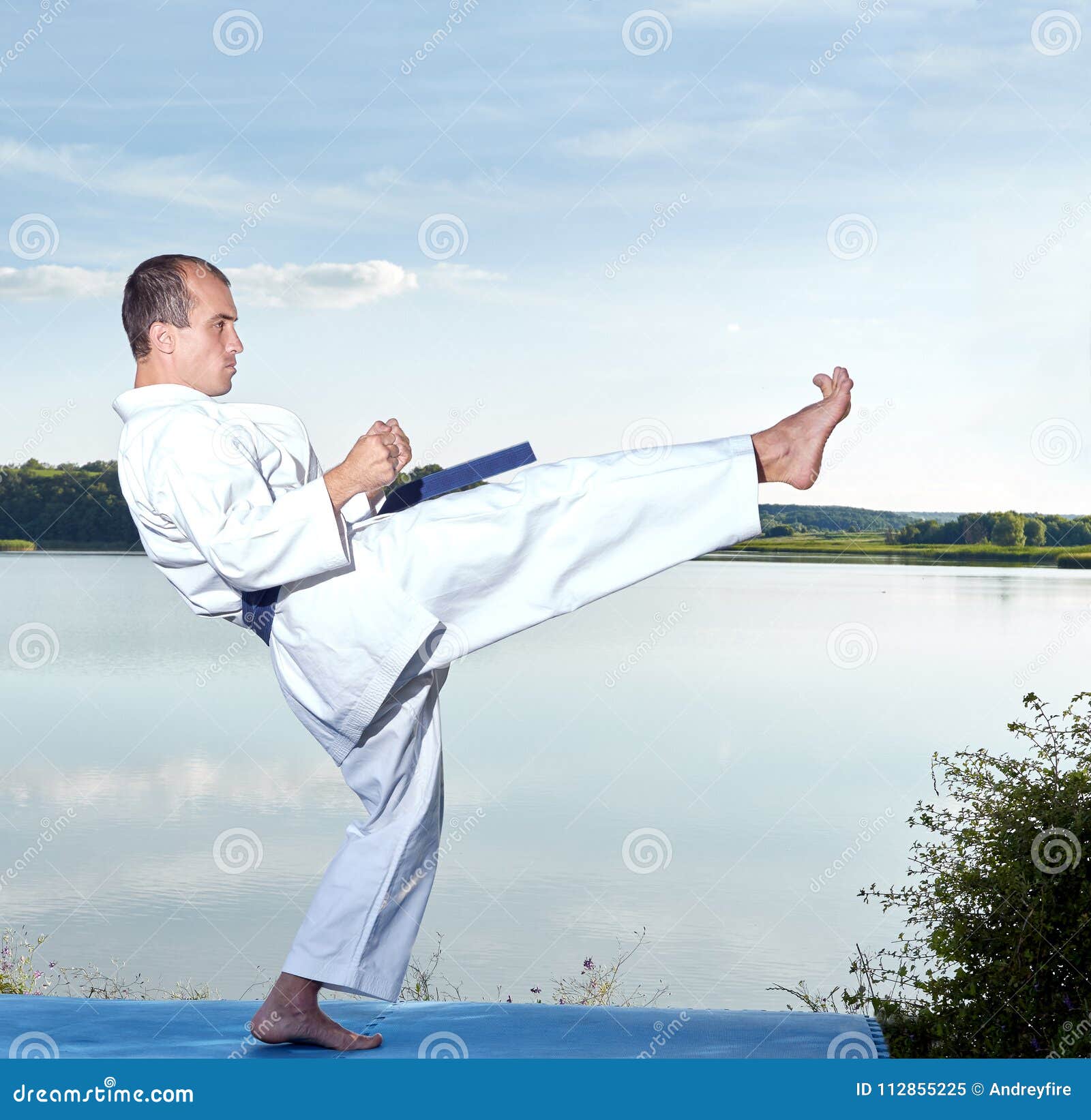 Athletes is Hitting a Kick Forward on the Lake Stock Image - Image of ...