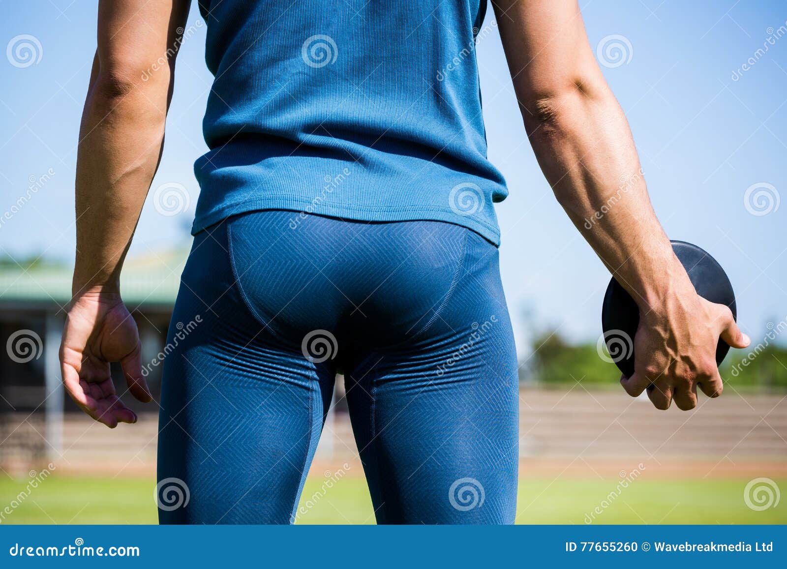 Athlete holding a discus stock photo. Image of athlete - 77655260