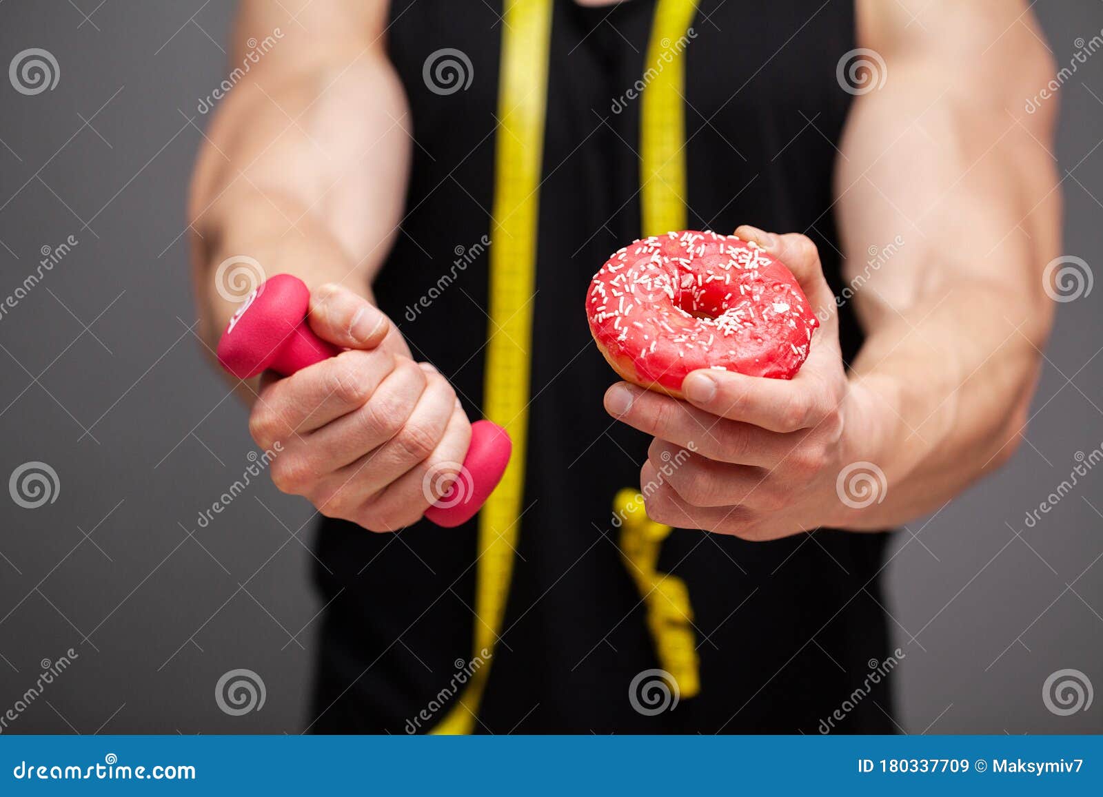 Athlete Holding Dumbbell and Donut Hint at Workout. Stock Image - Image ...